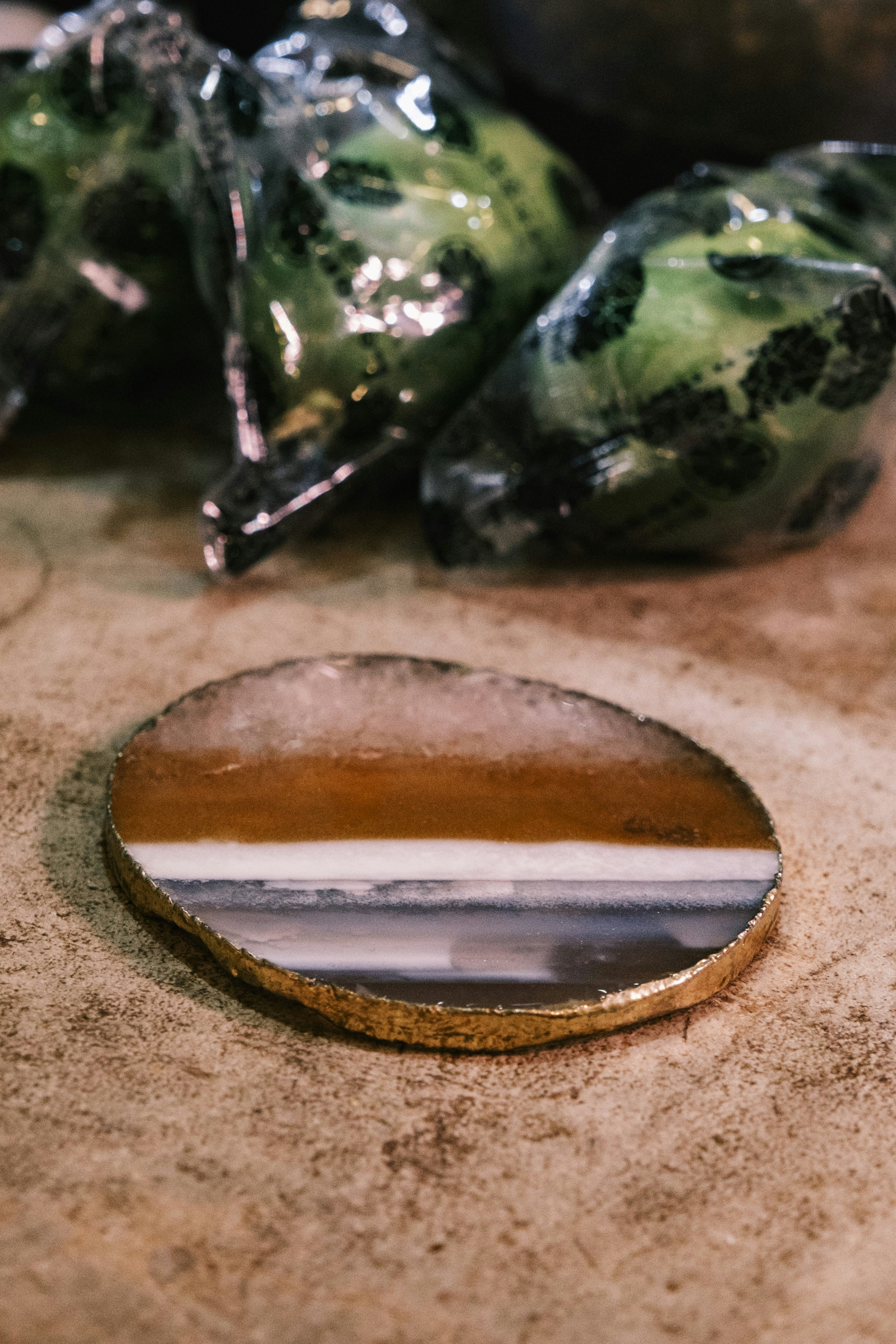 Grounded Slice: A Metallic Ring Reflects Earthy Tones