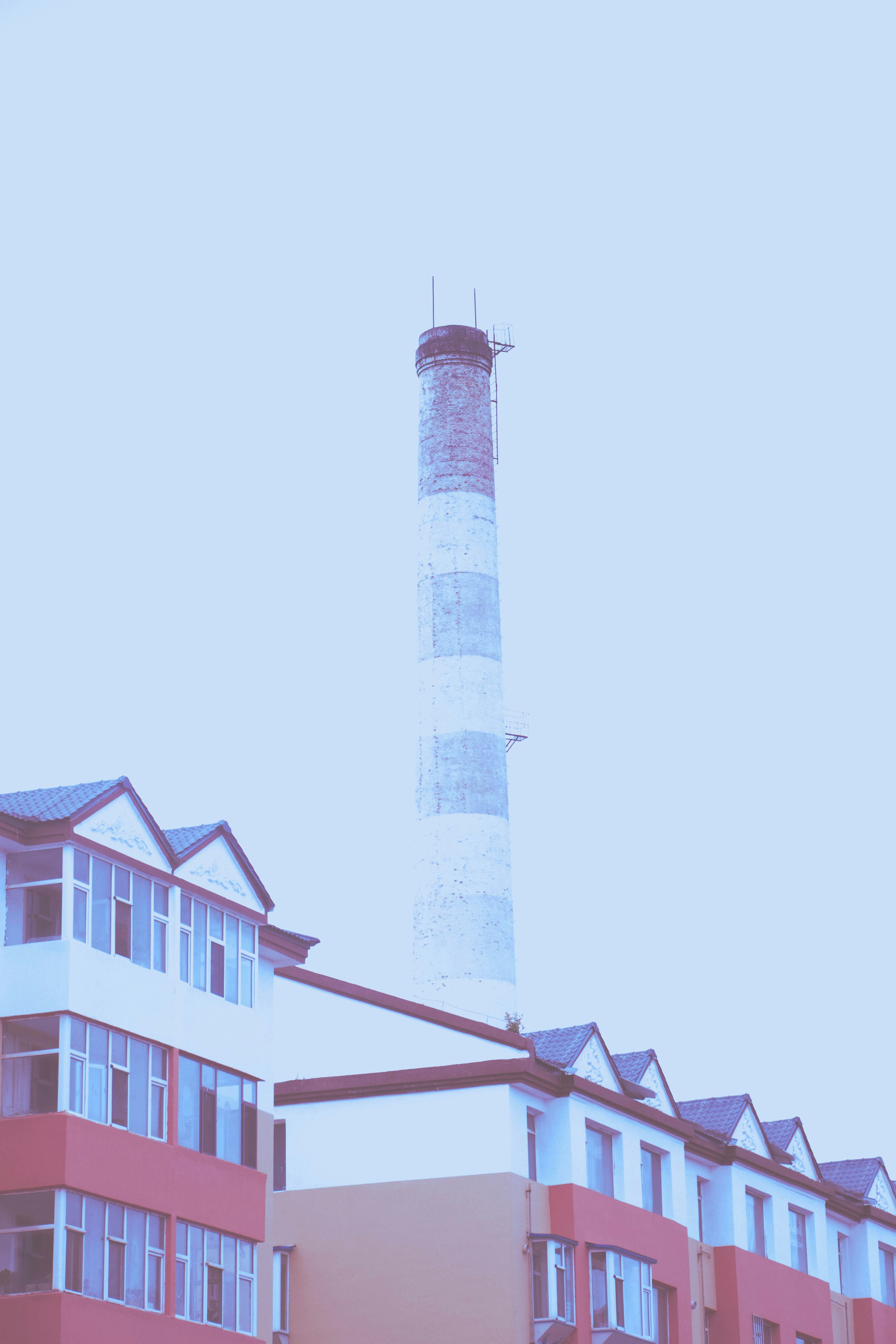 Skyward Chimney Amid Color-Block Architecture