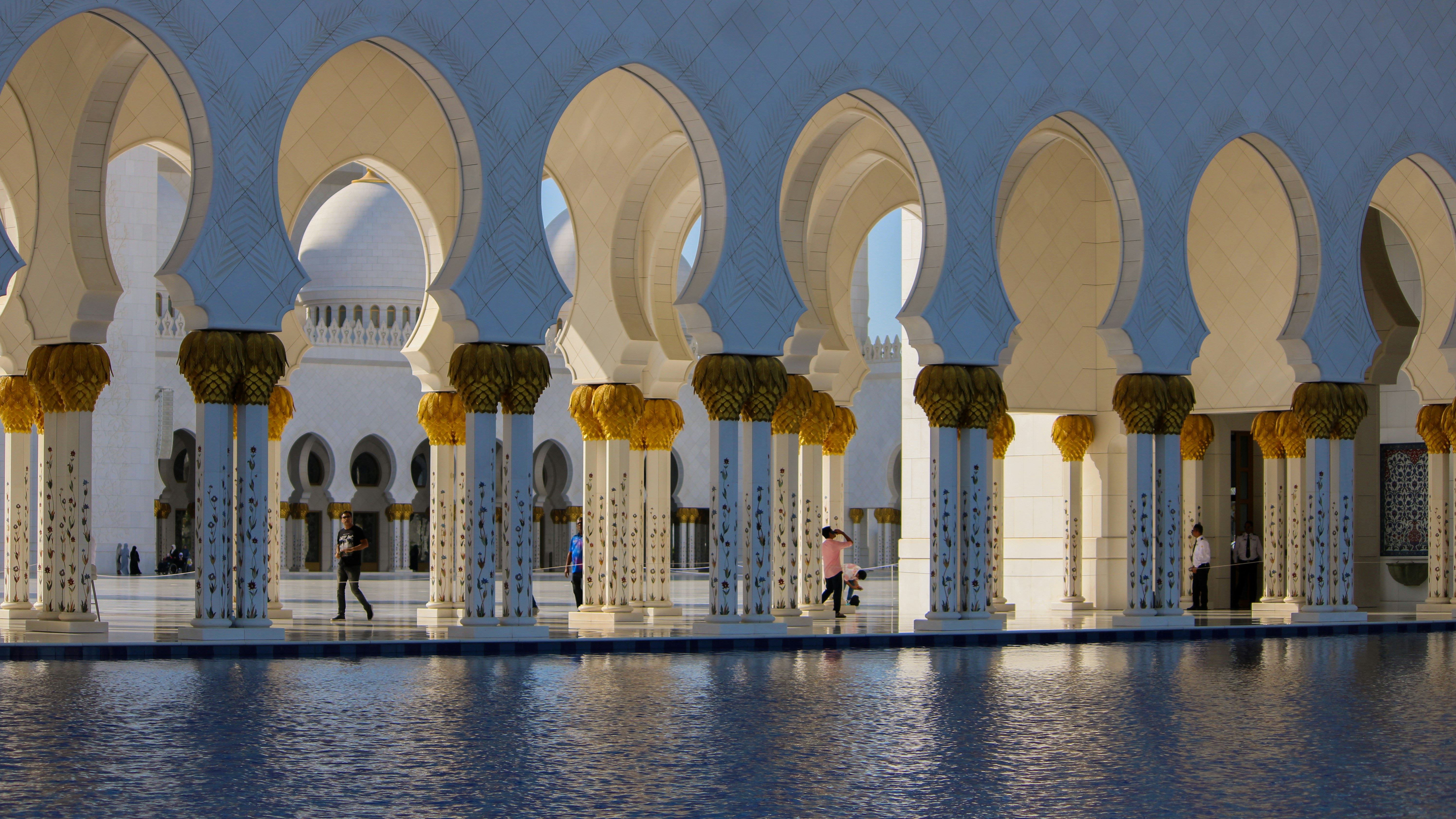 A view of a building with many arches and pillars photo – Free Abstract ...