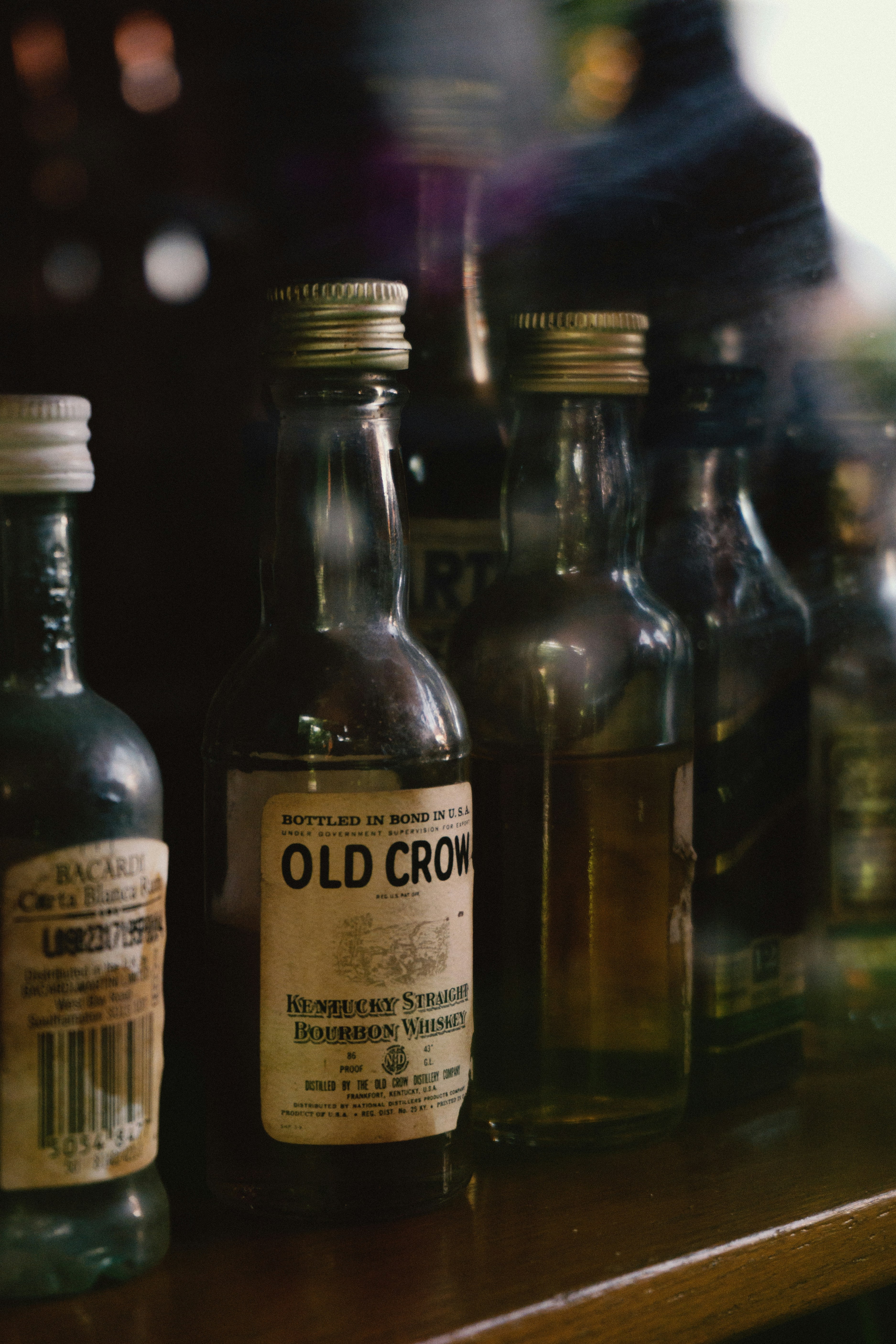 Old Crown on the Shelf: A Quiet Moment with Whiskey Bottles