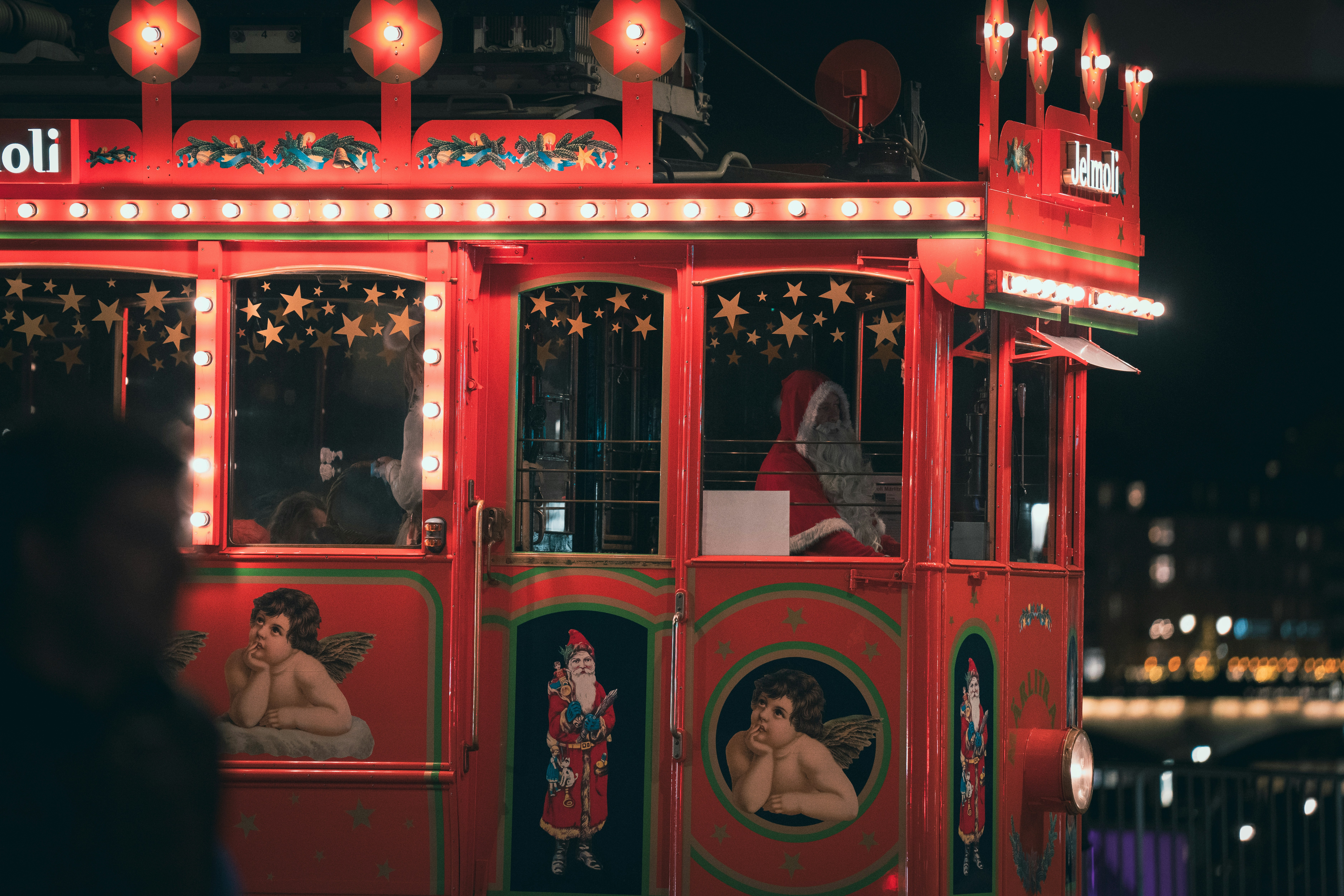 A red trolley car with lights on top of it photo – Free Woman Image on ...