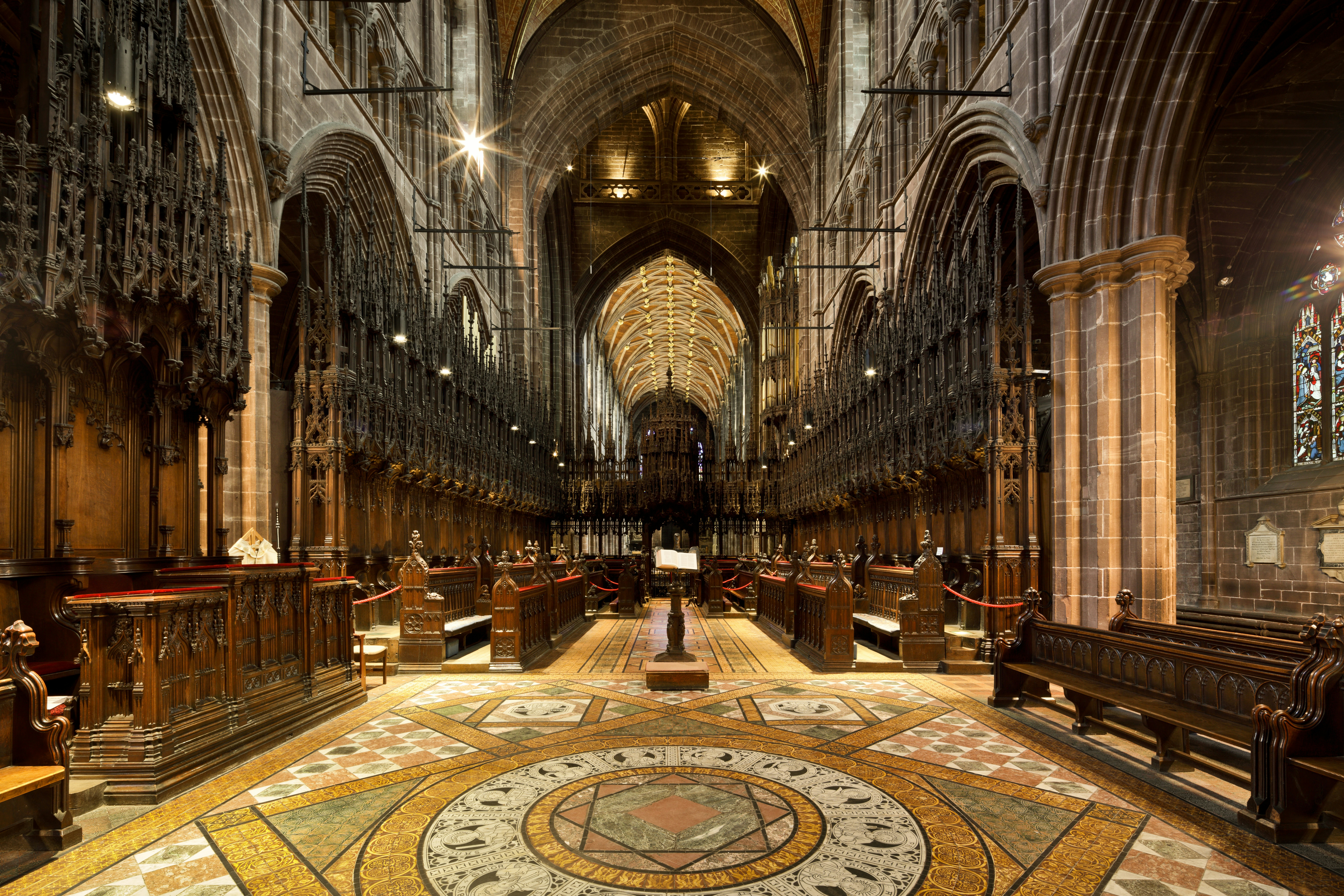 A large cathedral with pews and stained glass windows photo – Free ...