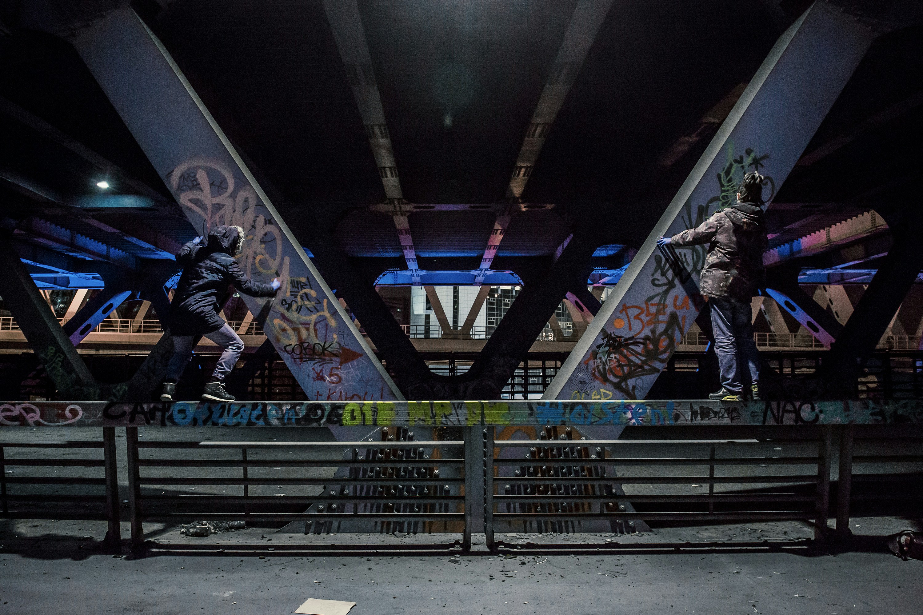 A group of people riding skateboards on top of a ramp photo – Free ...
