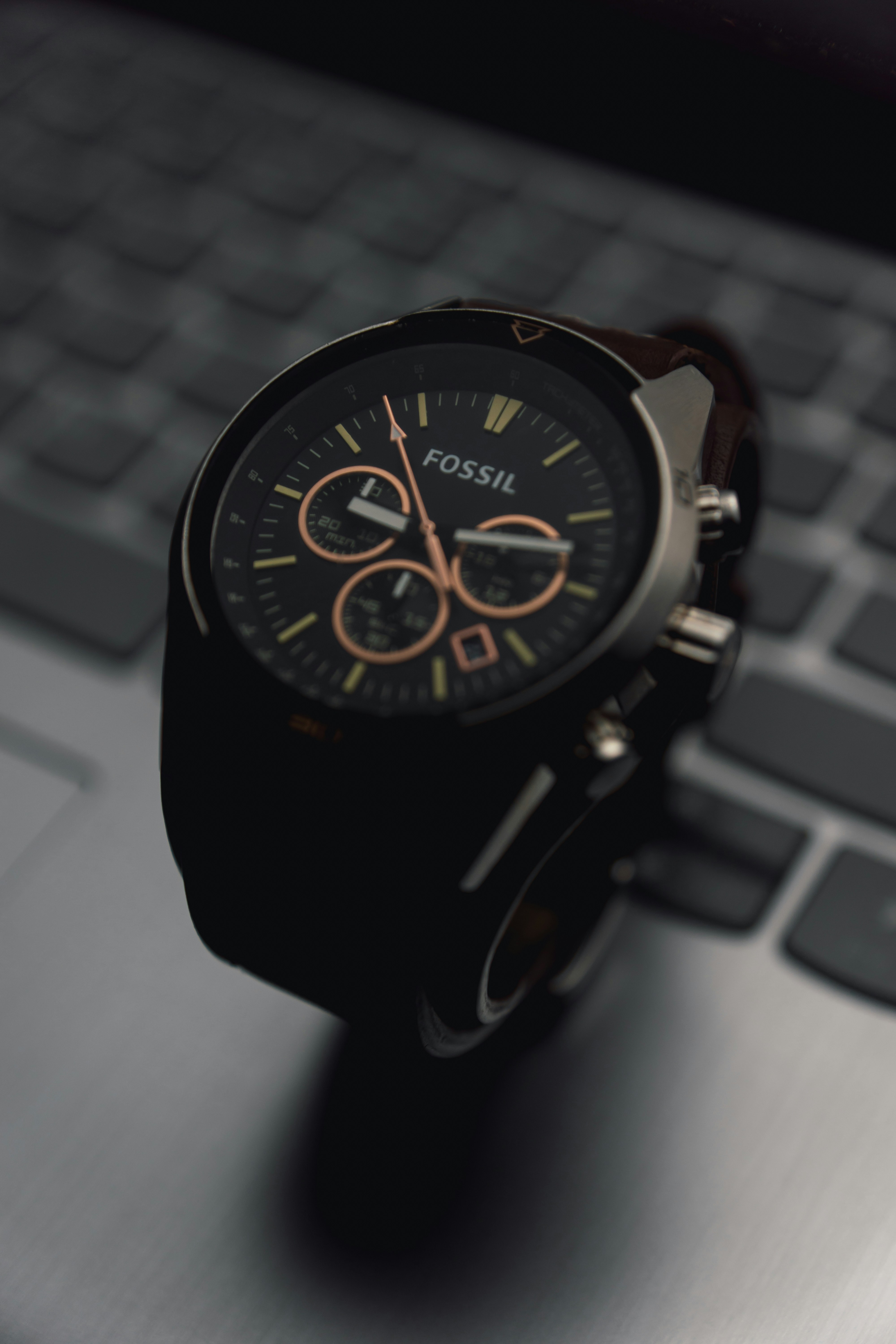Fossil Chronograph on a Quiet Laptop Keyboard: A Moody Macro Moment
