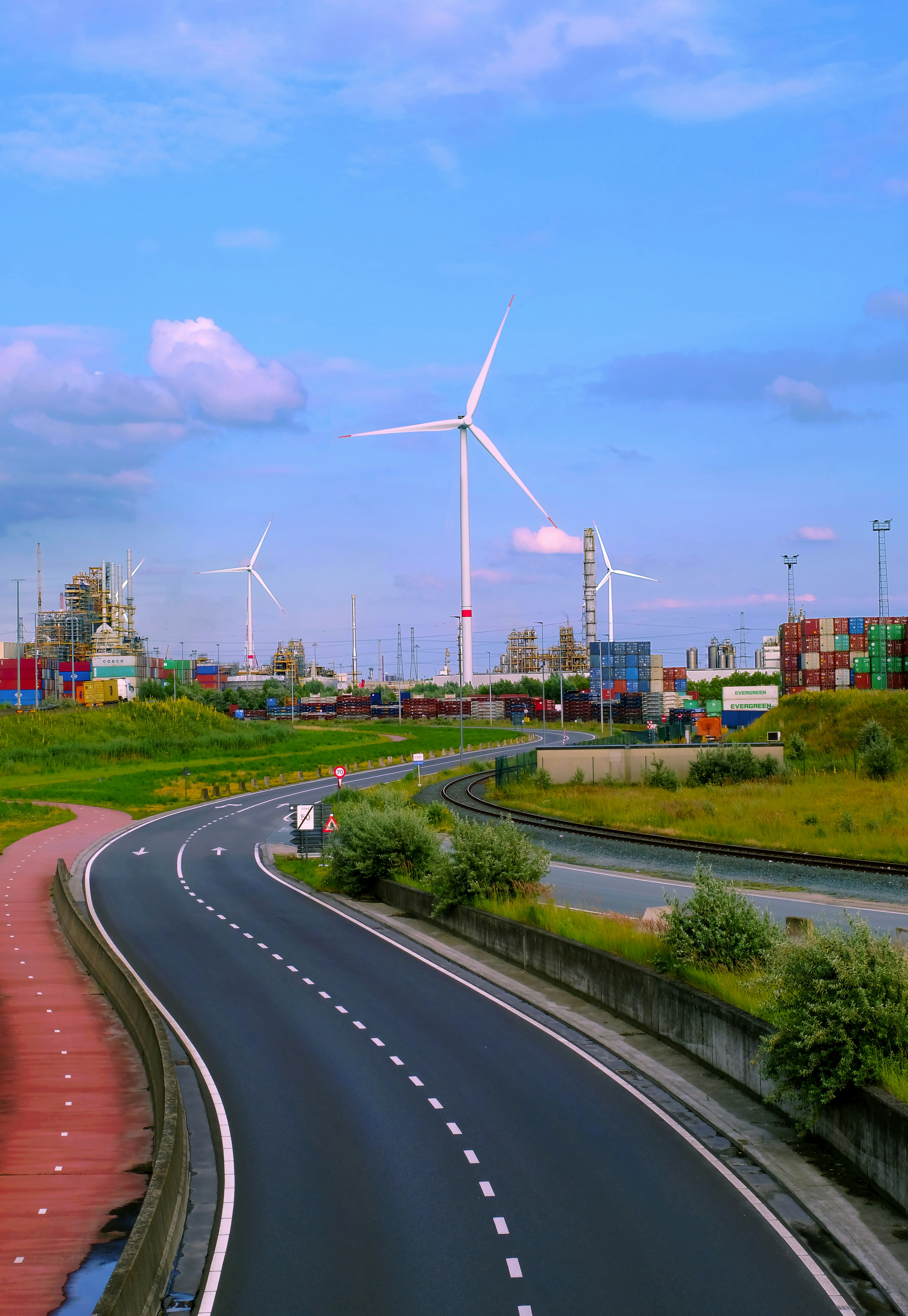 A highway with wind turbines in the background photo – Free Beveren ...