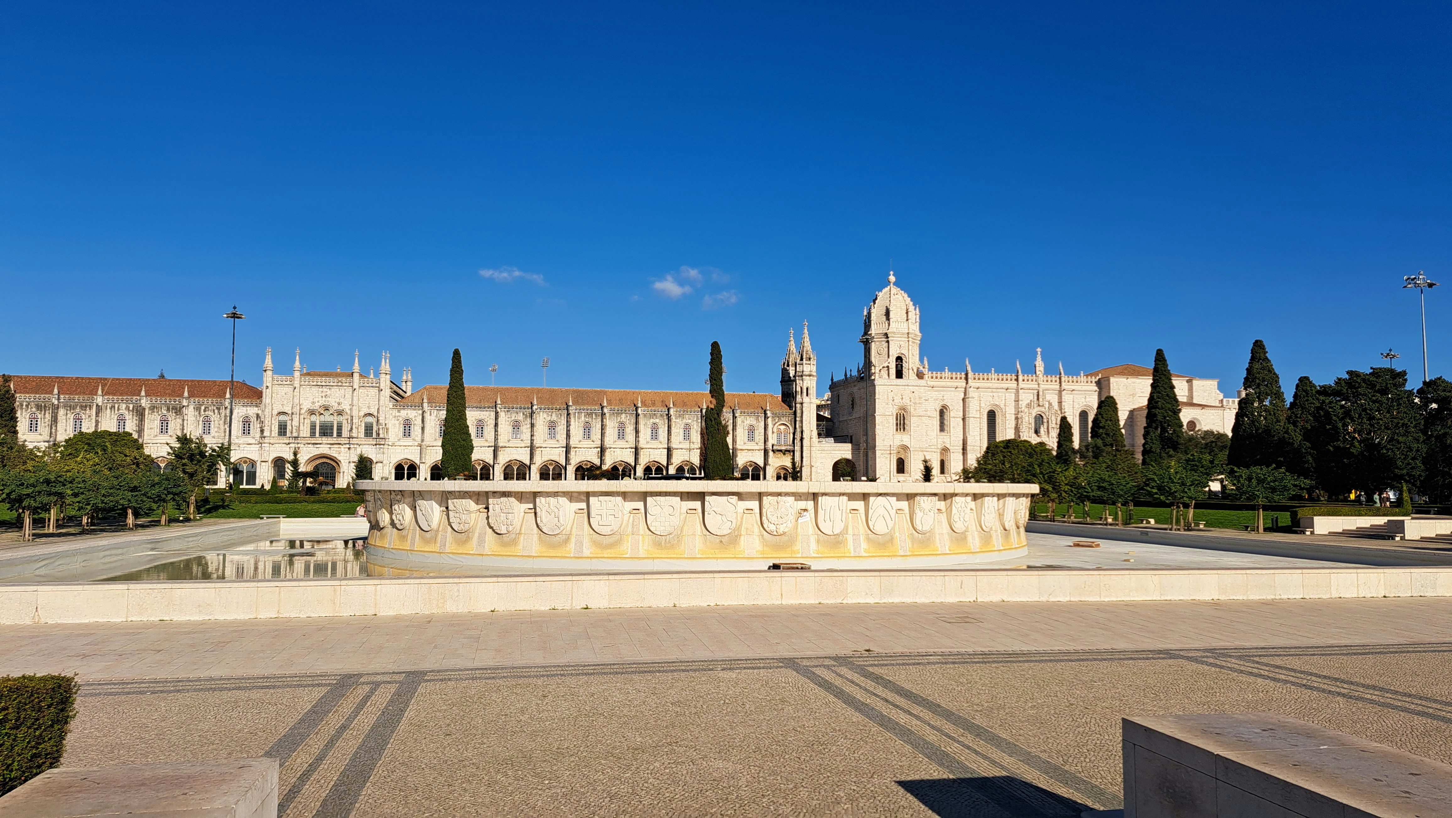Belém's Sunlit Symmetry: Fountain Framing a Monumental Facade