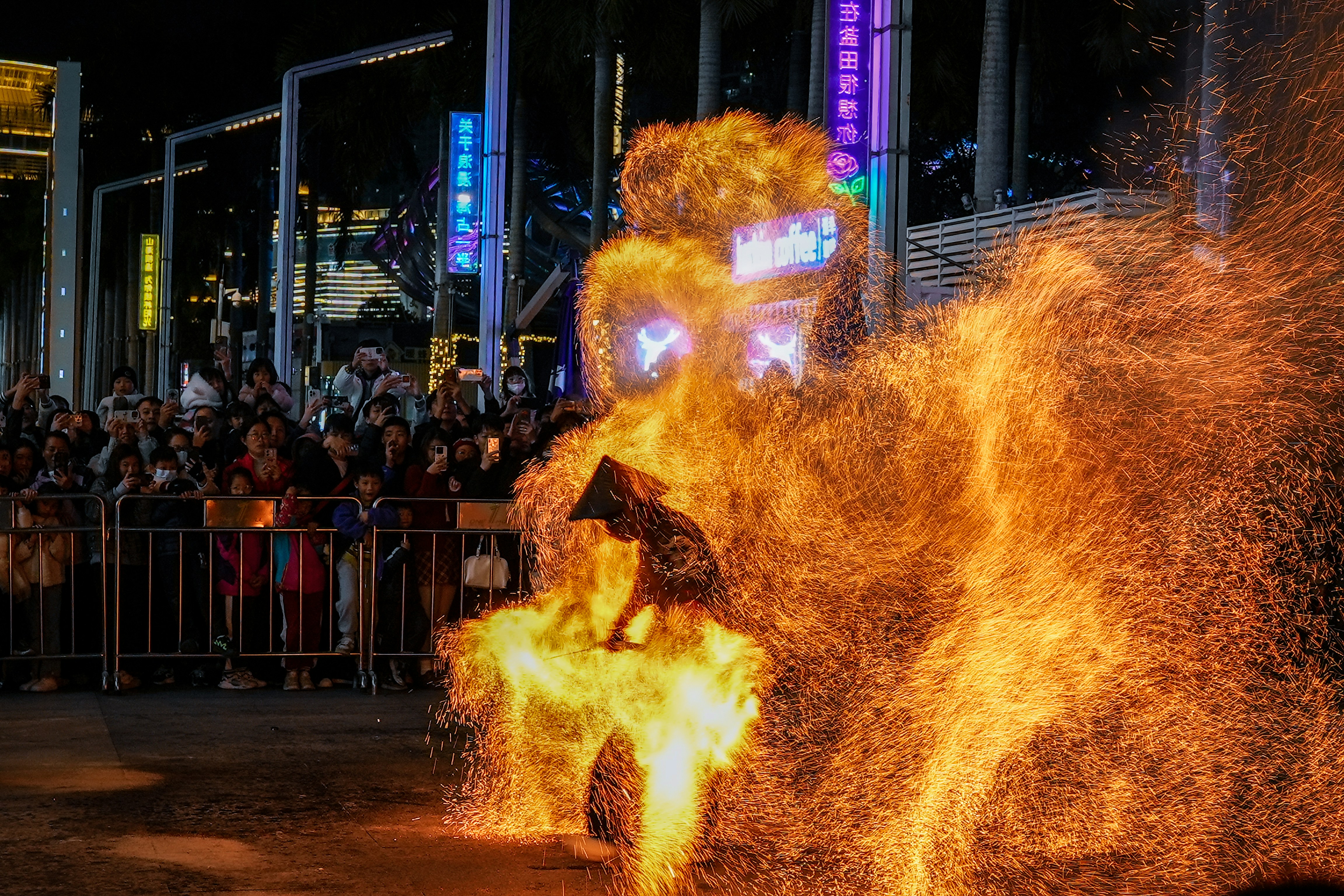 Flaming Performer Surrounded by Fire Splash at Night Street Show