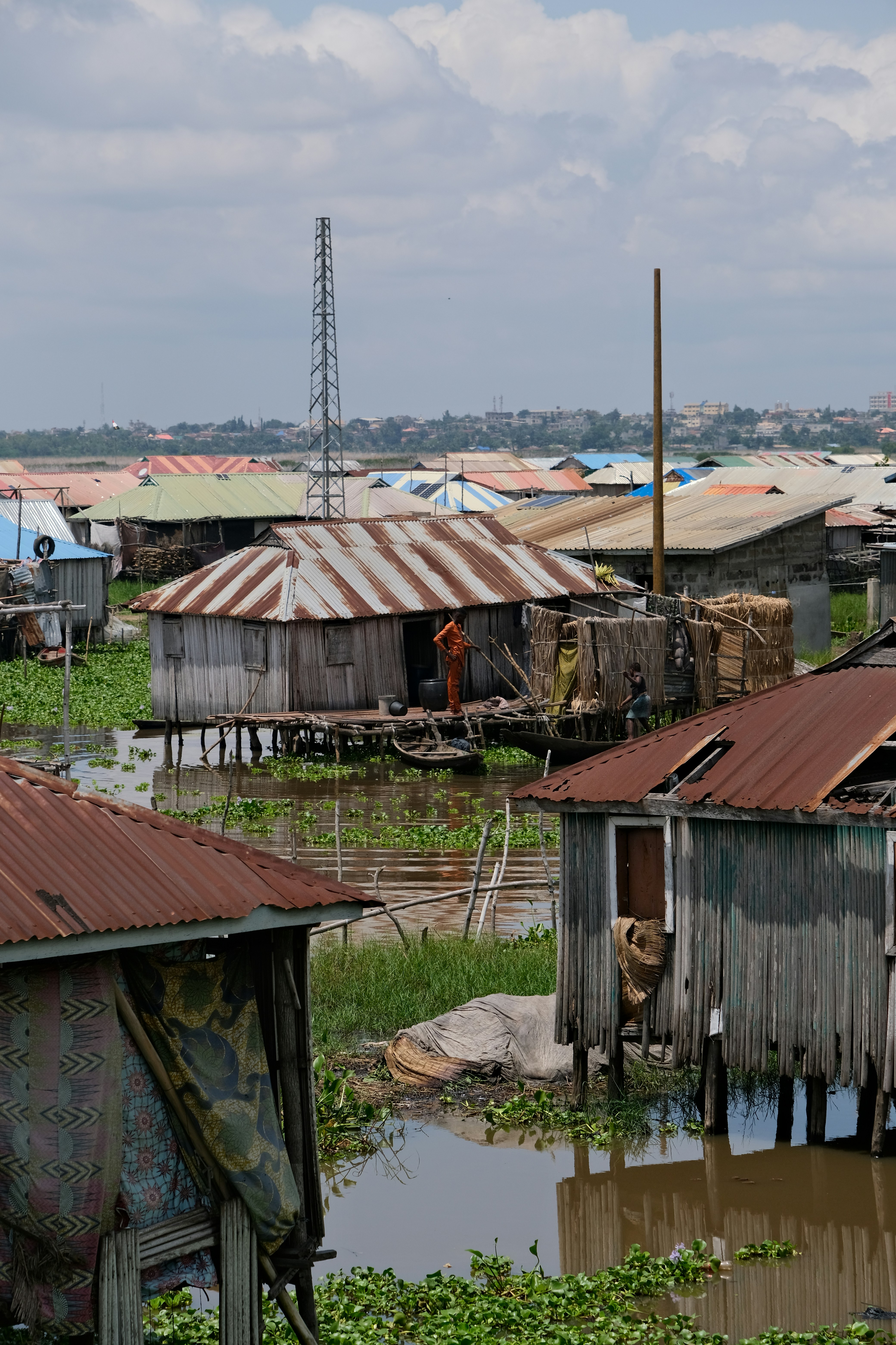 A group of shacks sitting next to each other photo – Free Ganvie Image ...