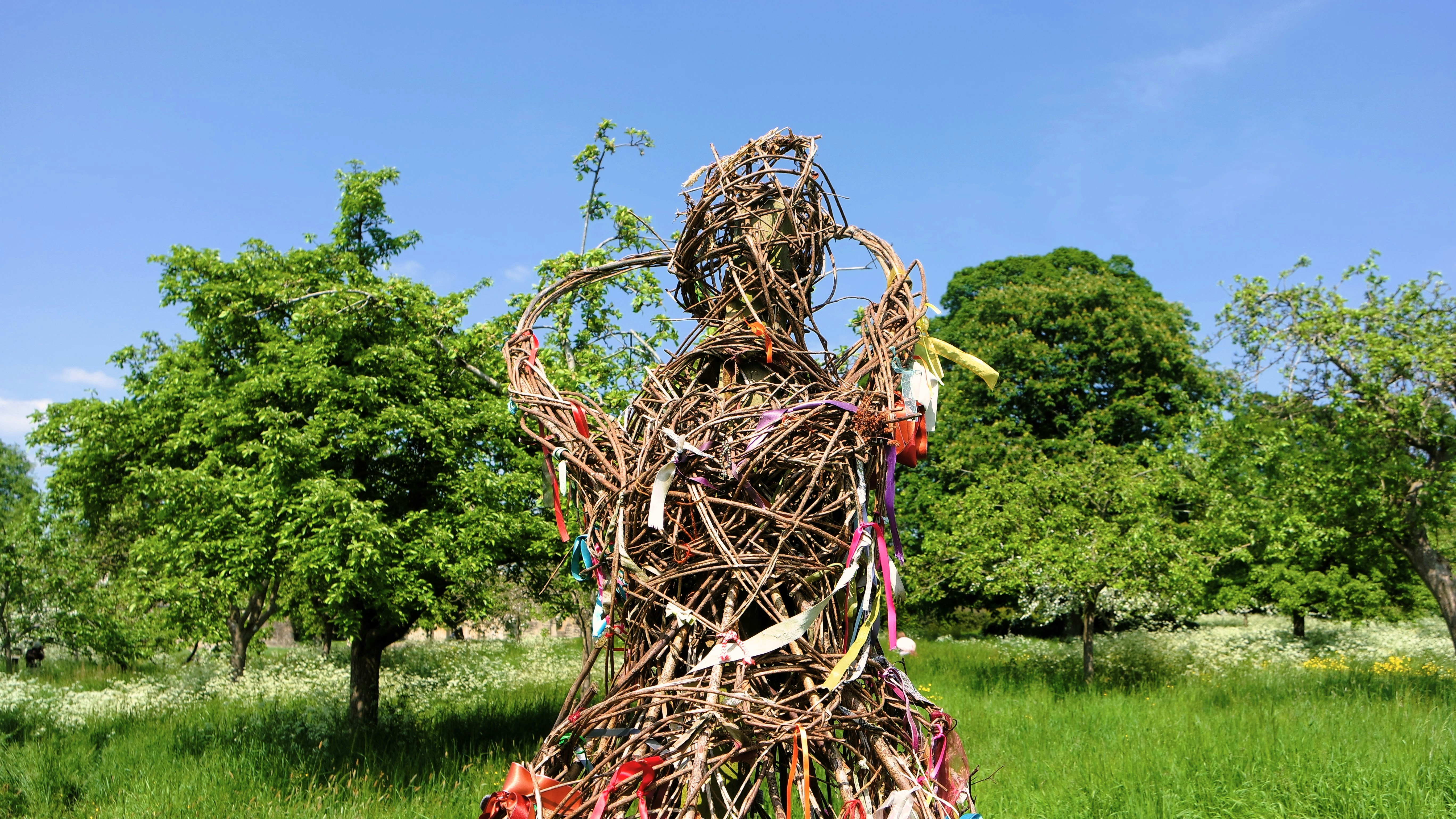 A sculpture of a person made out of sticks