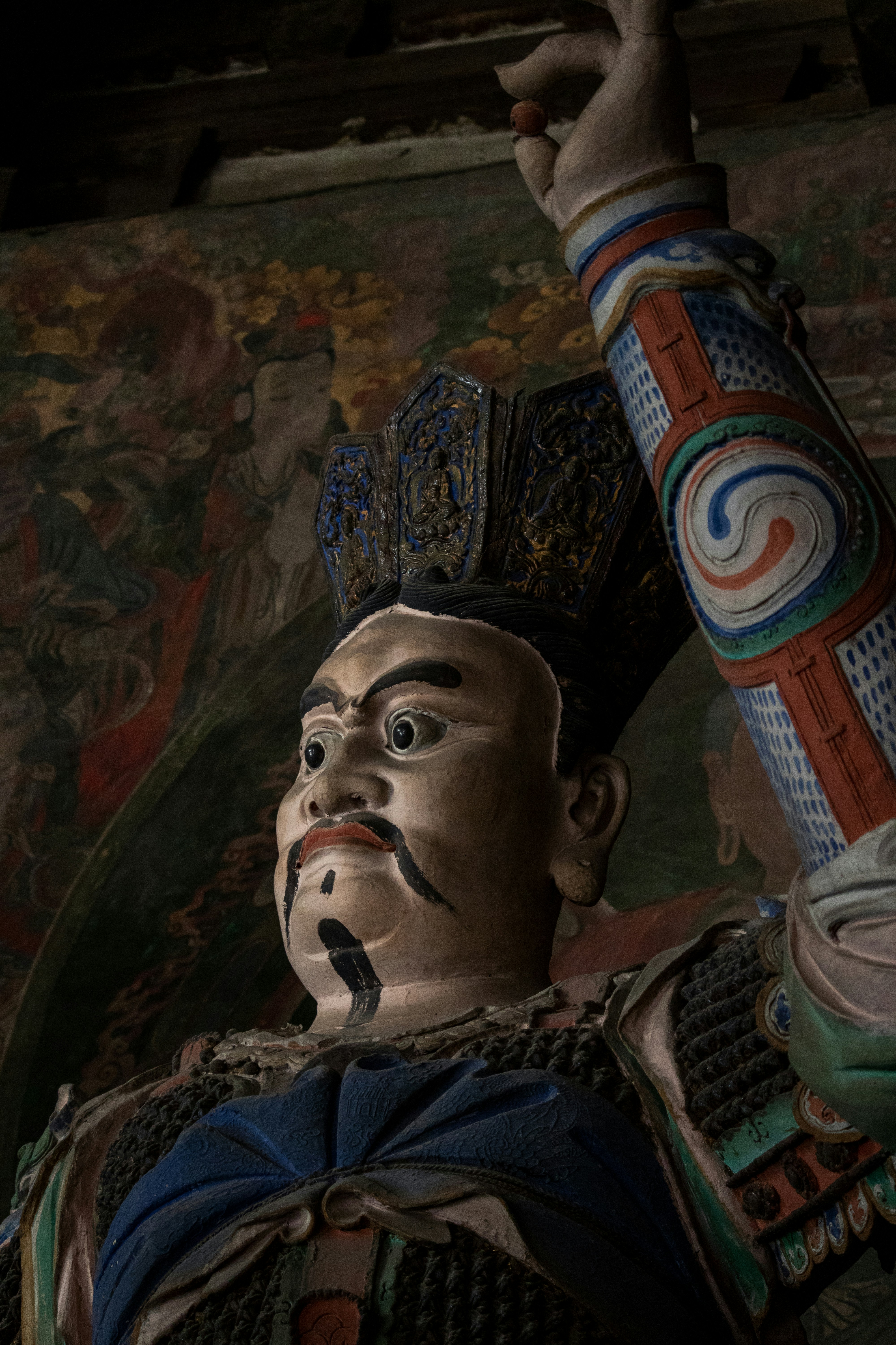 A close up of a statue of a man holding a pipe photo – Free Datong ...