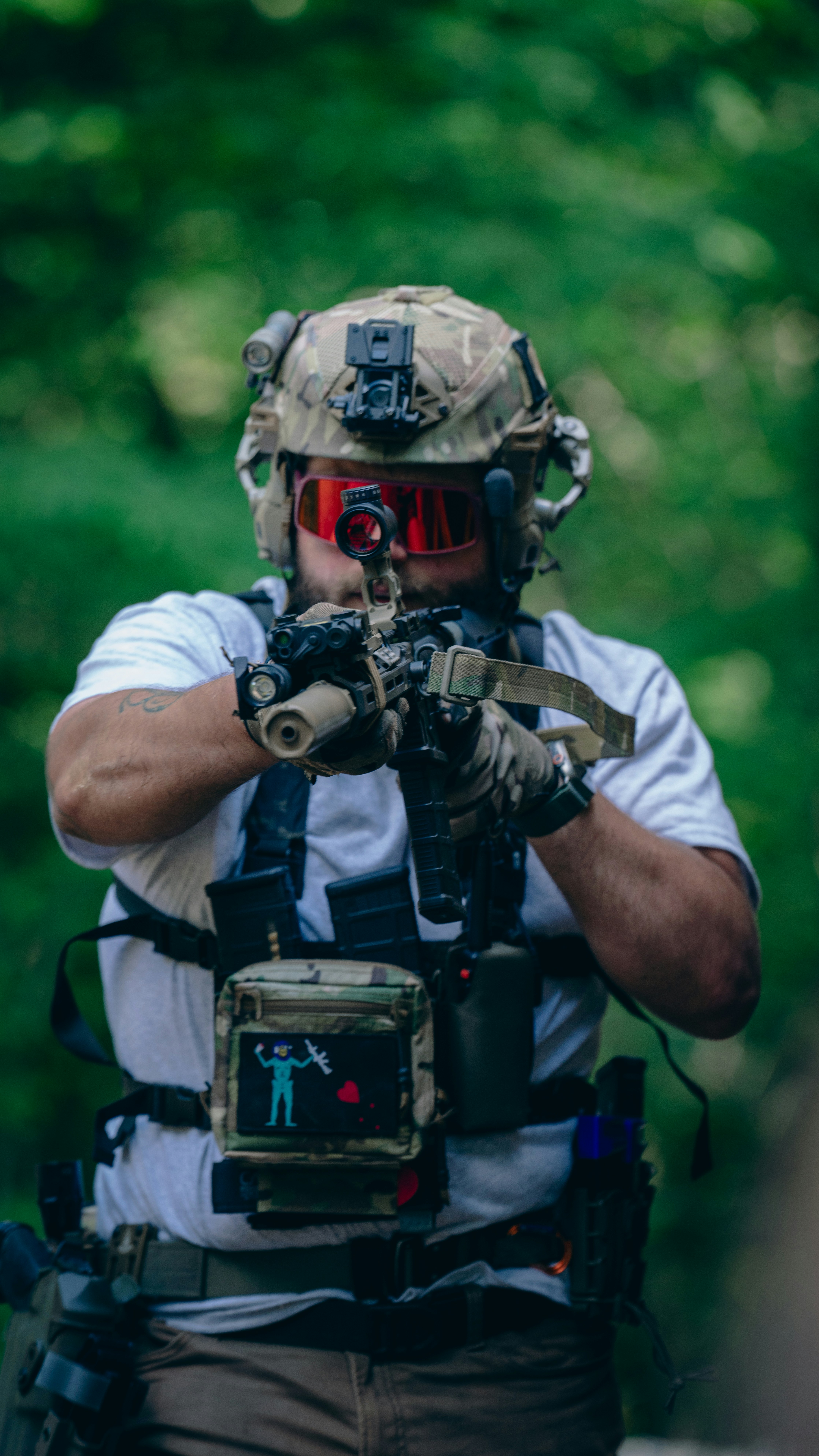 Verdant Ambush: A Tactical Marksman Zeroed in a Forest Glow