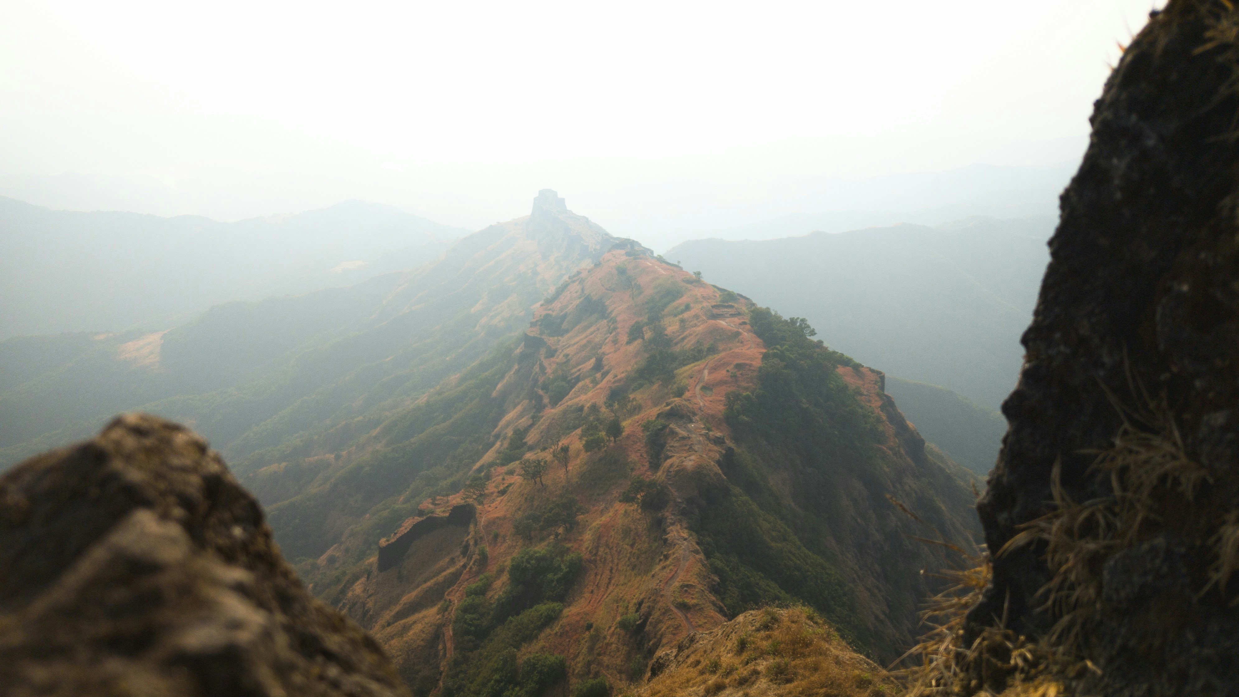 A view of a mountain range from the top of a mountain photo – Free ...