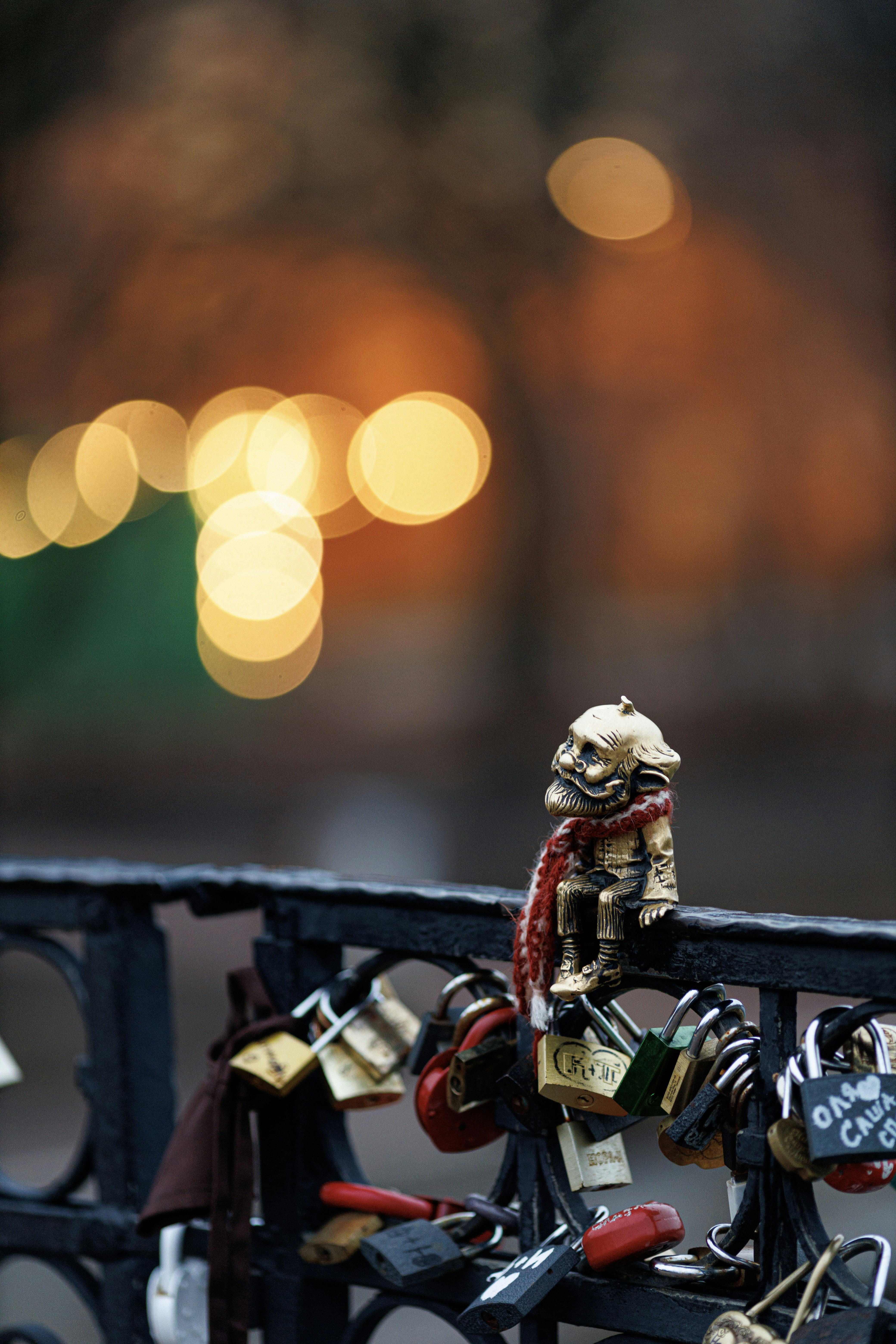 Tiny Caesar on a Bridge: A Misterioso Figurine Guarding the Locks