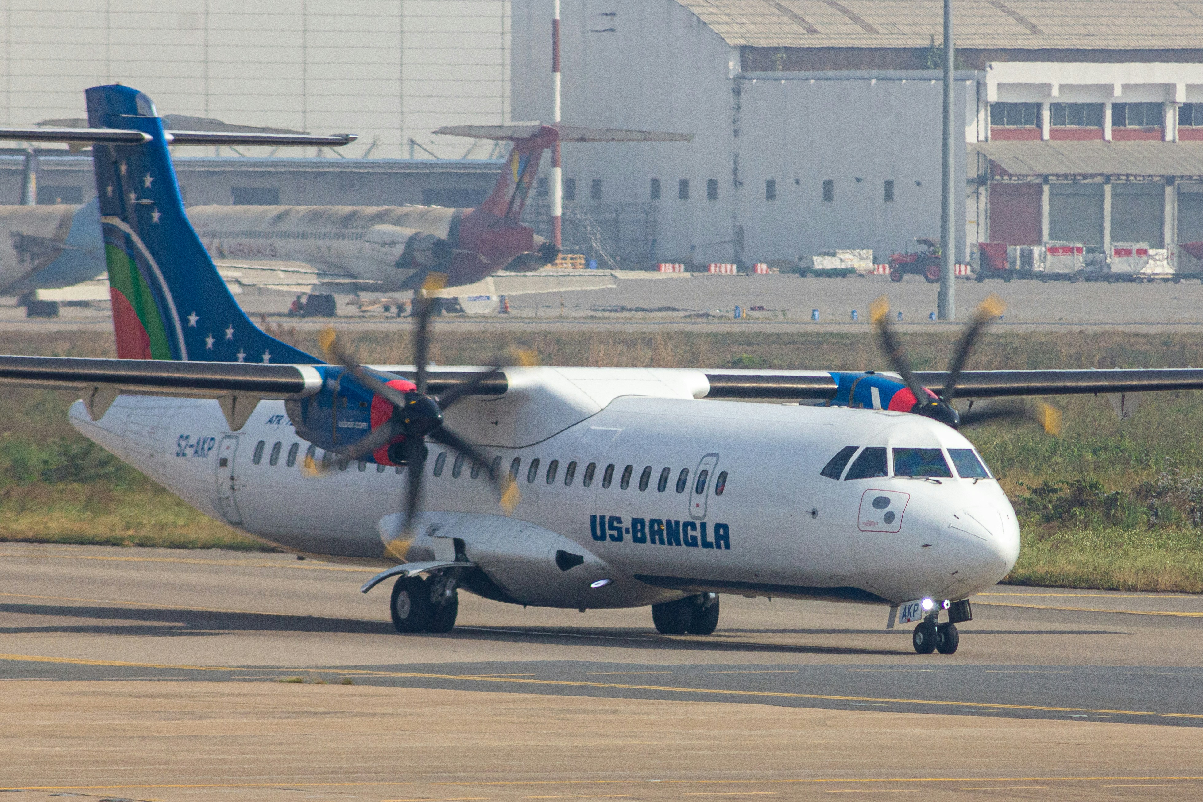 A large white airplane on a run way photo – Free Commercial use Image ...