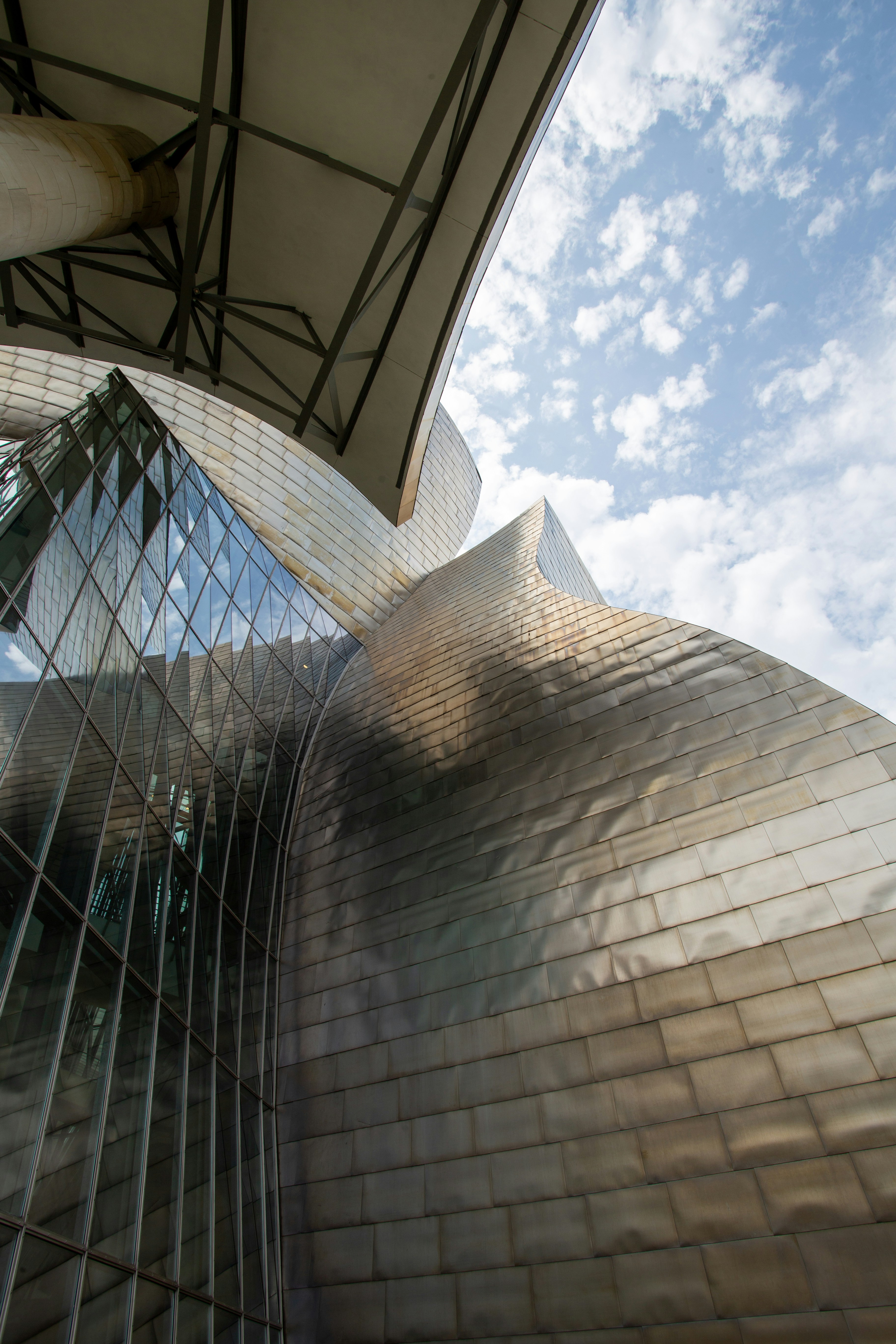 Liquid Titanium Facade: Curves, Glass, and Sky