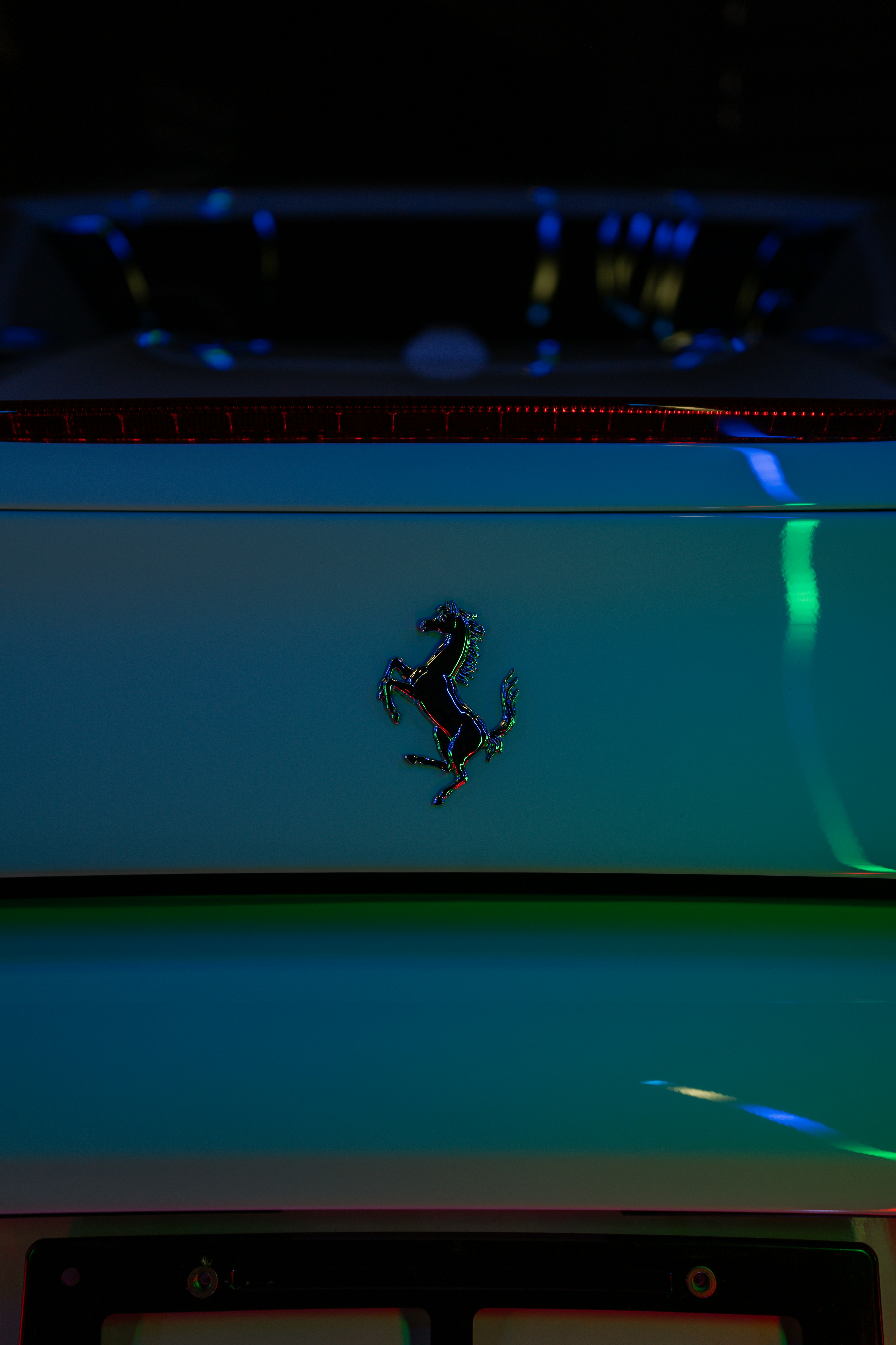 Prancing Prancing: A Ferrari Emblem in Neon Night