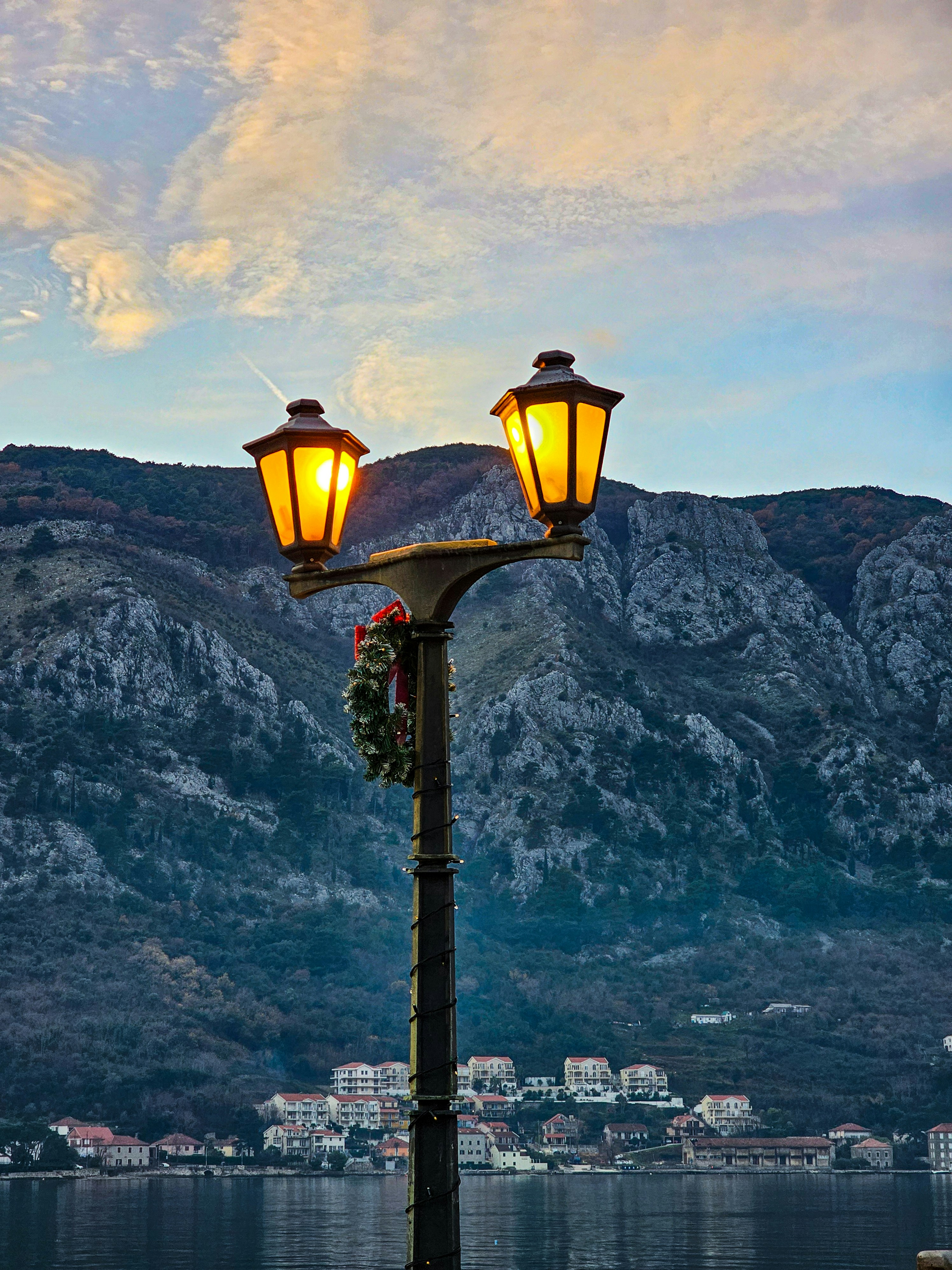 Twin Lanterns over a Quiet Alpine Lake at Dusk