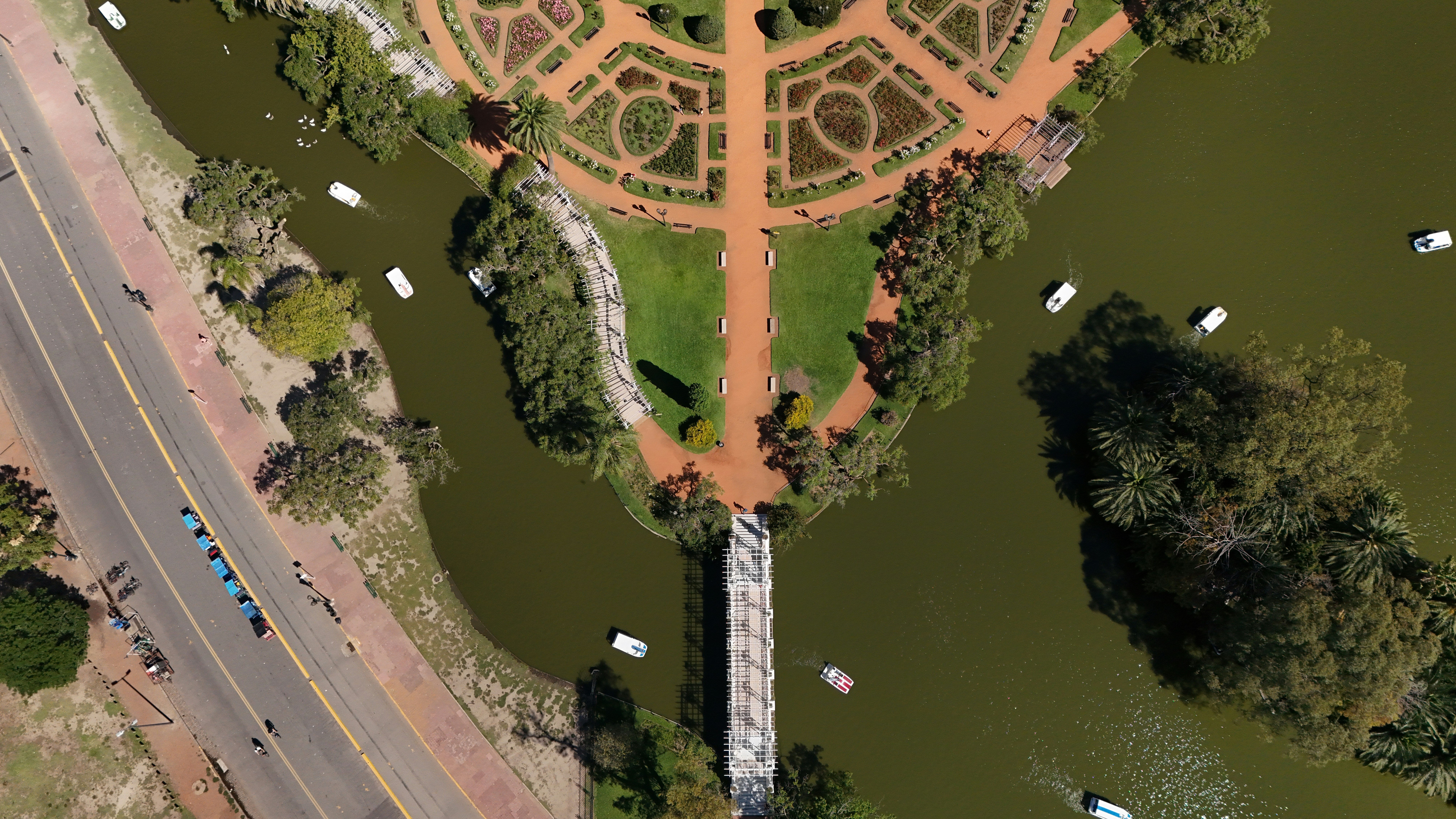 White Footbridge Framing a Circular Garden Parterre