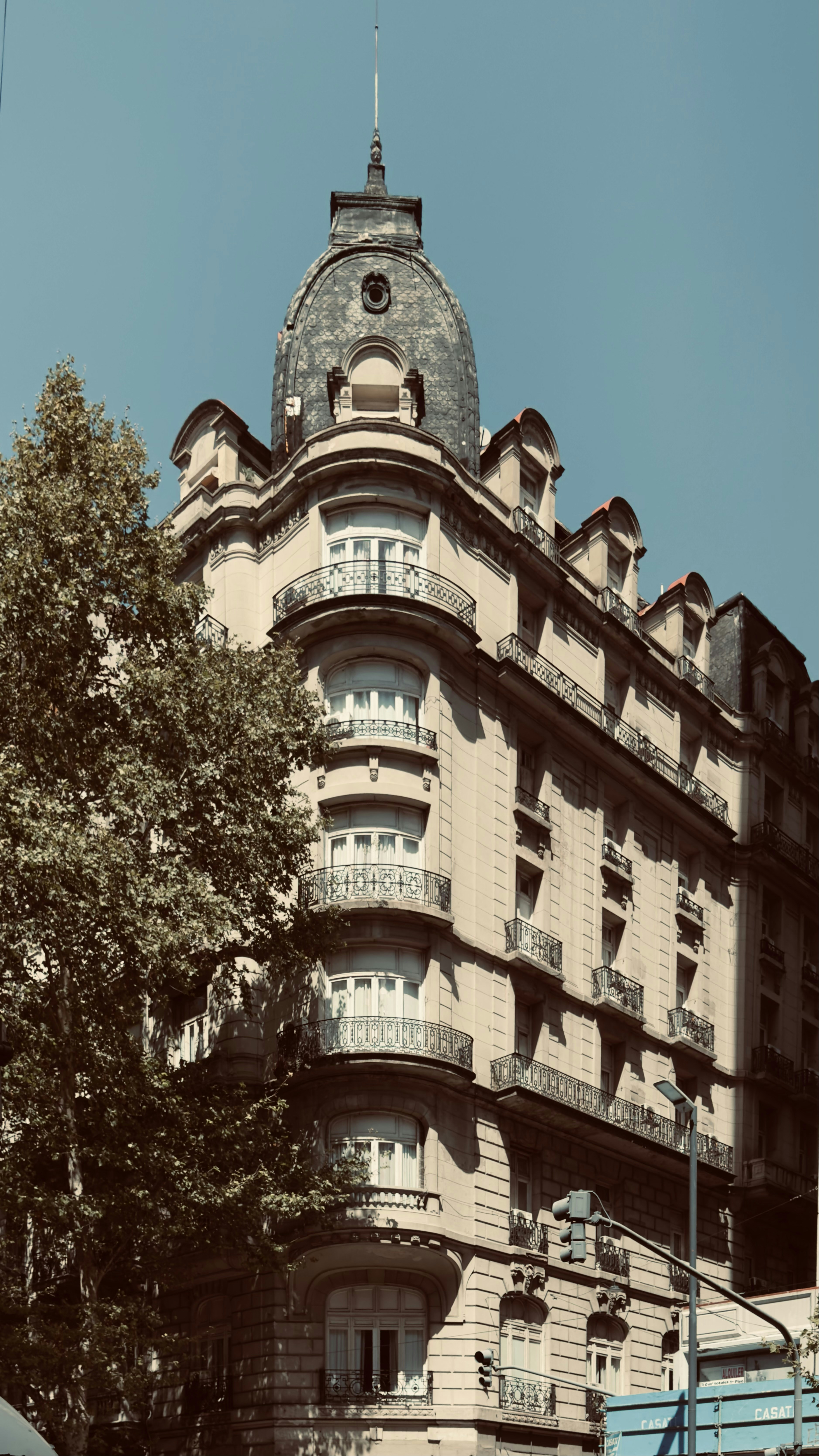 Dome-Crowned Haussmann Facade Reaching Toward a Blue Sky