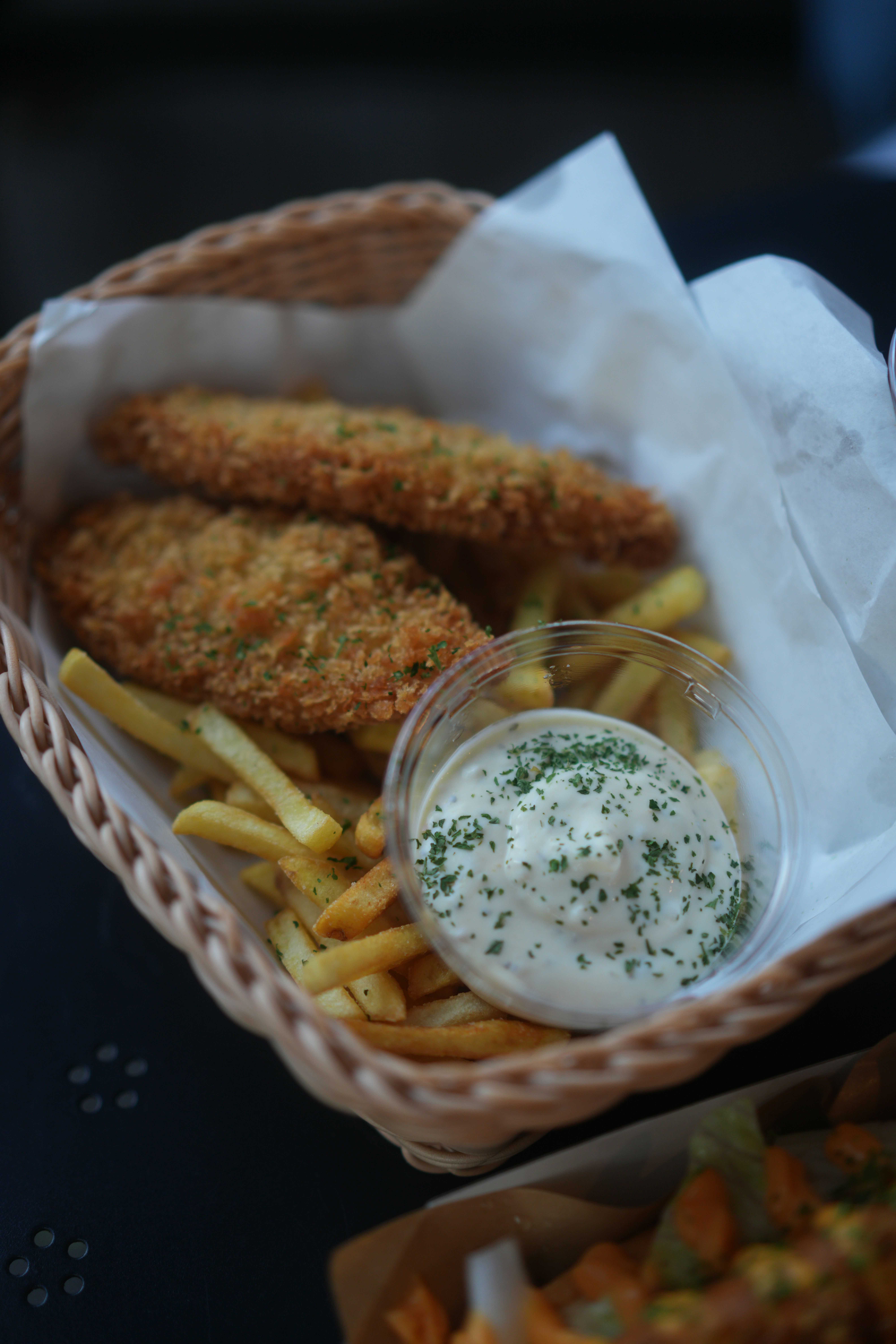Crispy Fish Fingers and Fries in a Rustic Basket with Herb Dip