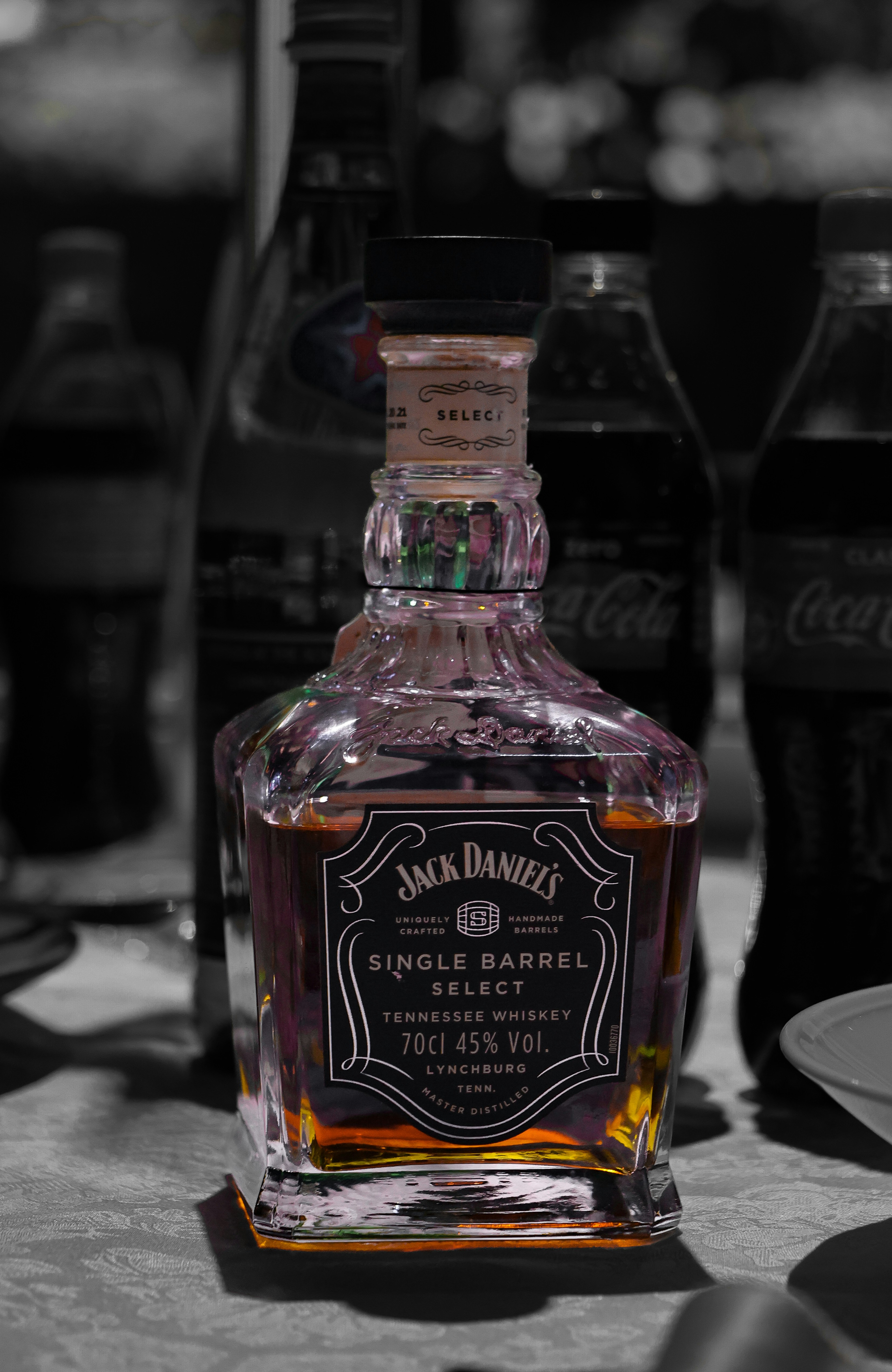 A bottle of jack daniels is sitting on a table photo – Free Perfume ...