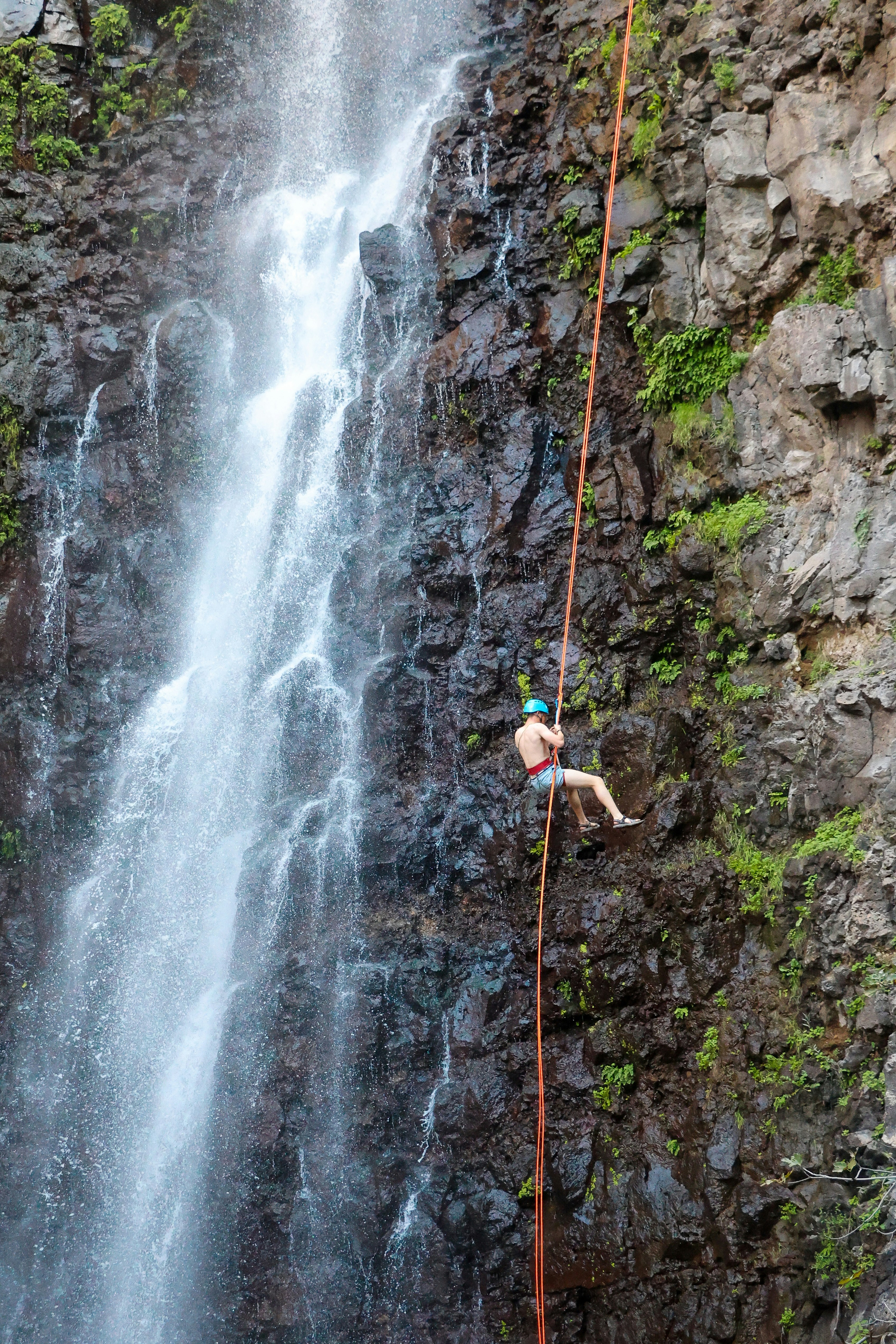 A man on a rope in front of a waterfall photo – Free Outdoors Image on ...