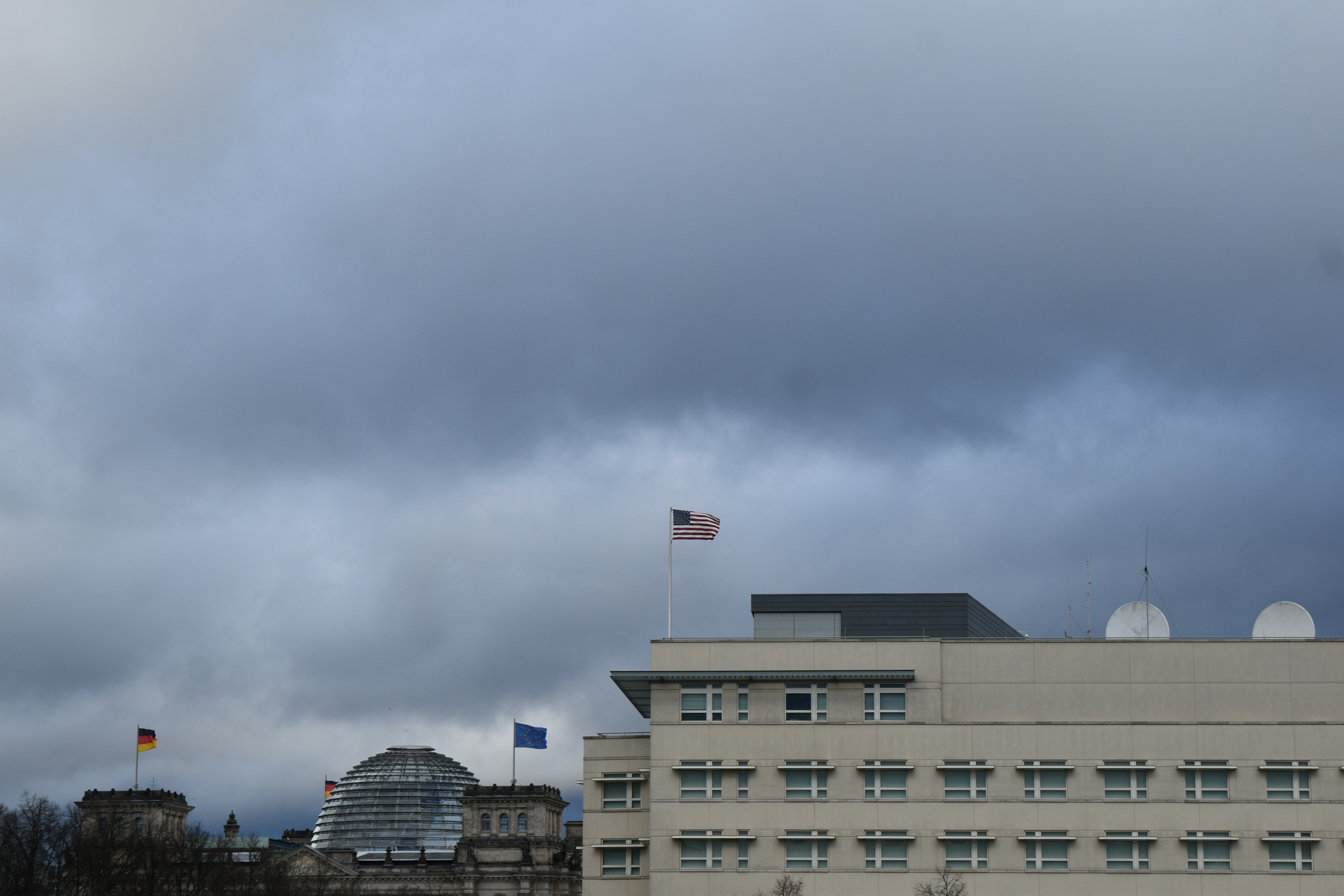 Flag Over the Grid: Quiet Geometry Beneath a Brooding Sky
