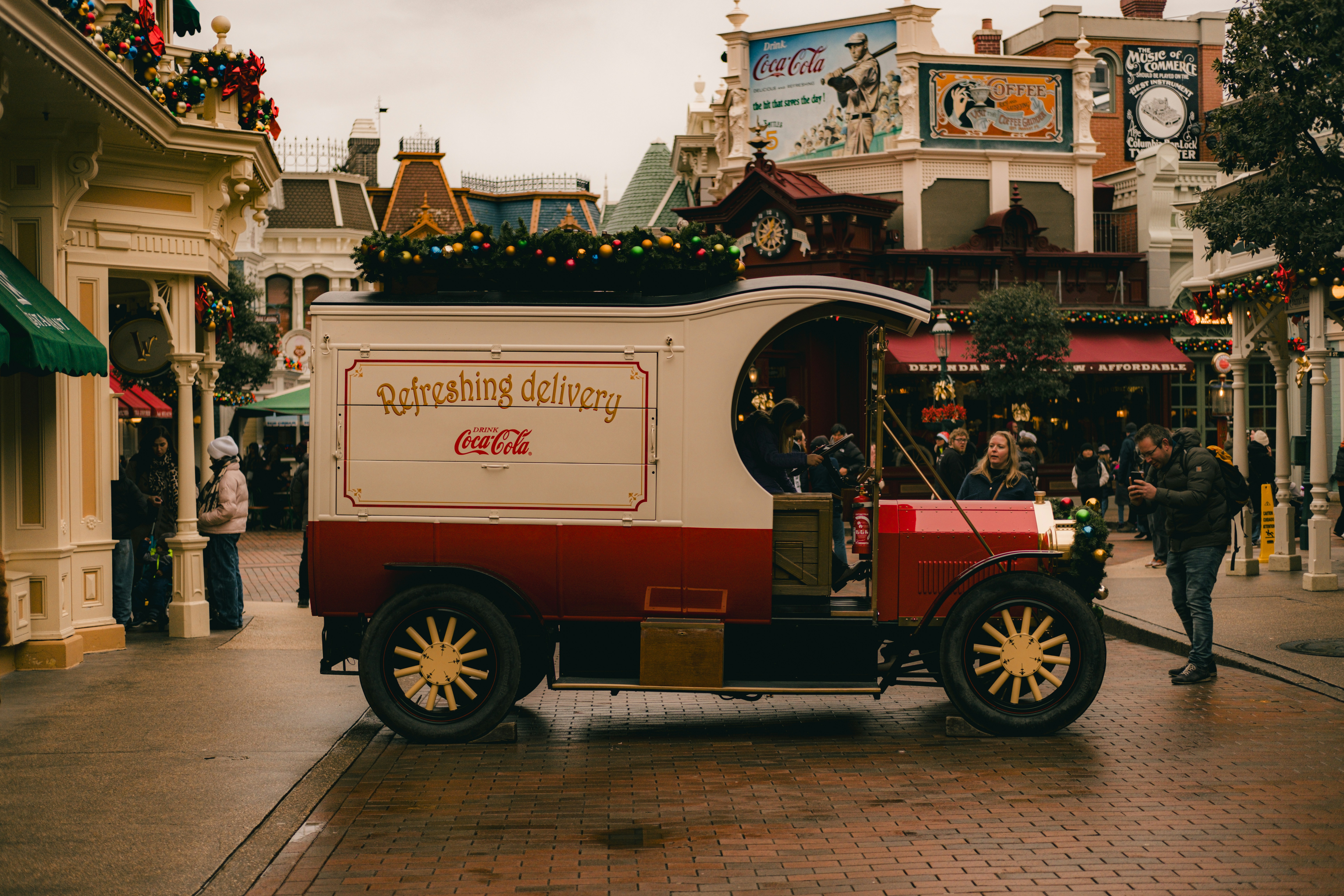 Vintage Coca-Cola Truck Anchors a Festive Street Scene