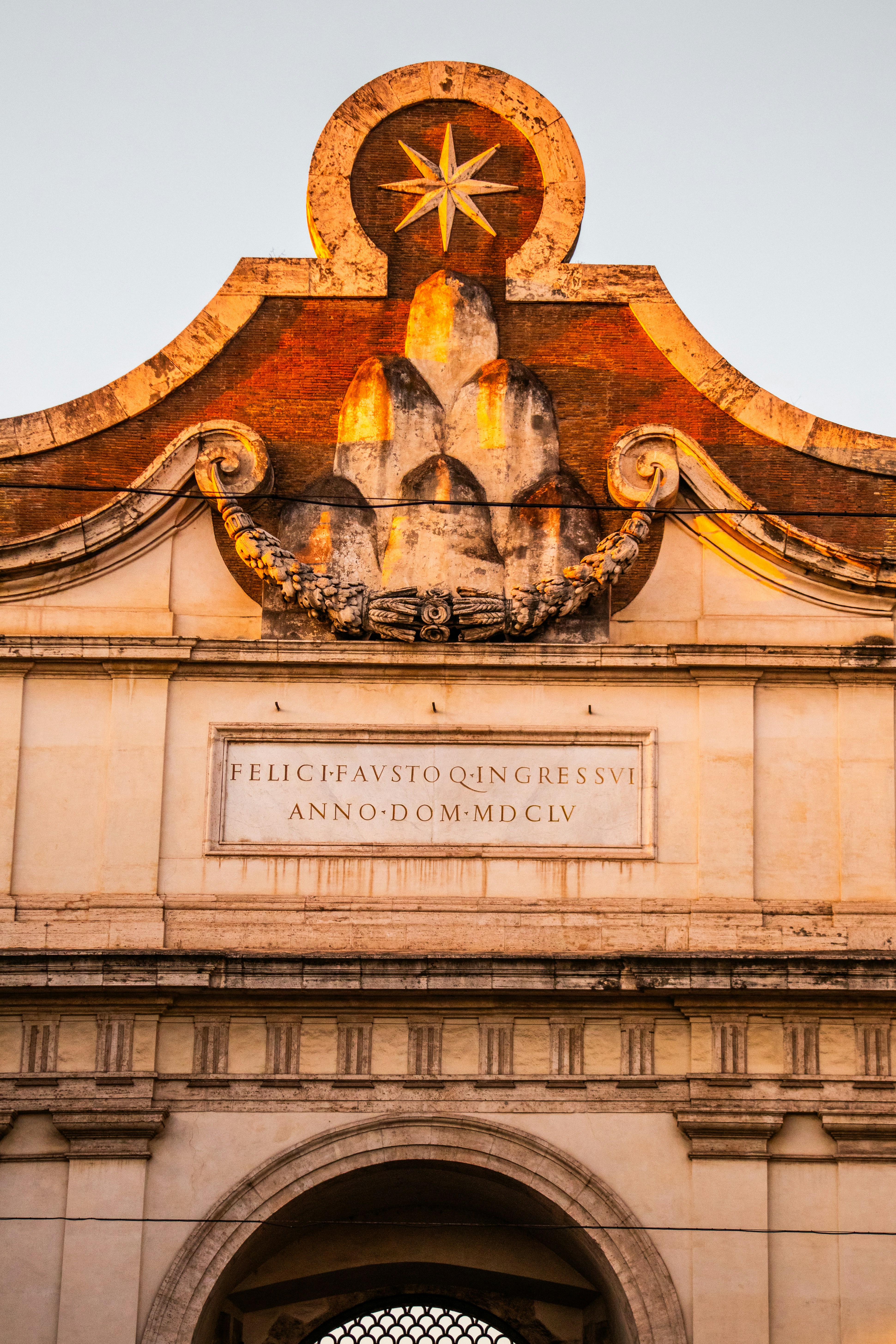 Sun-Star Crest Above a Marble Archway