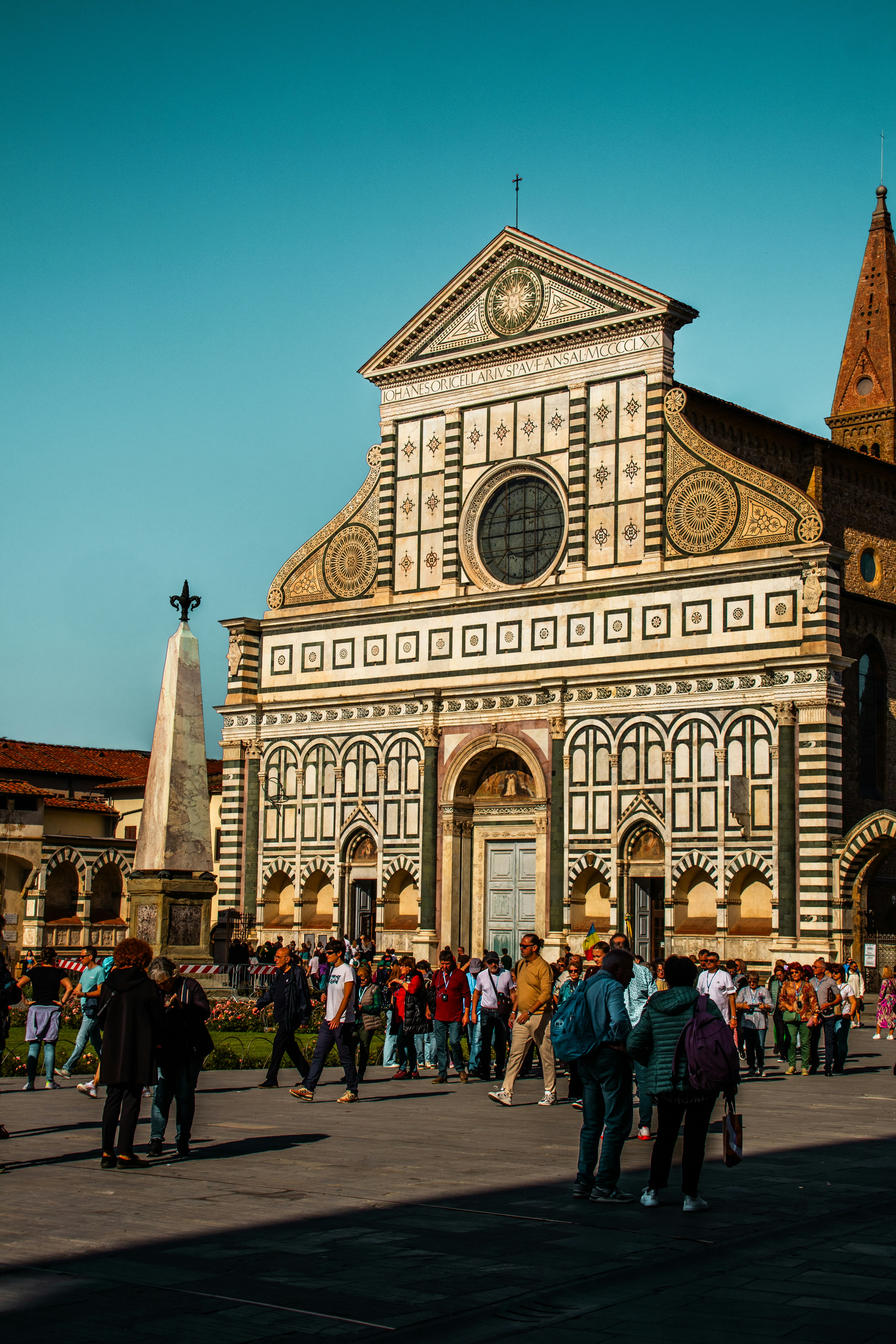 Striped Marble Cathedral: A Florentine Facade Framed by a Busy Piazza