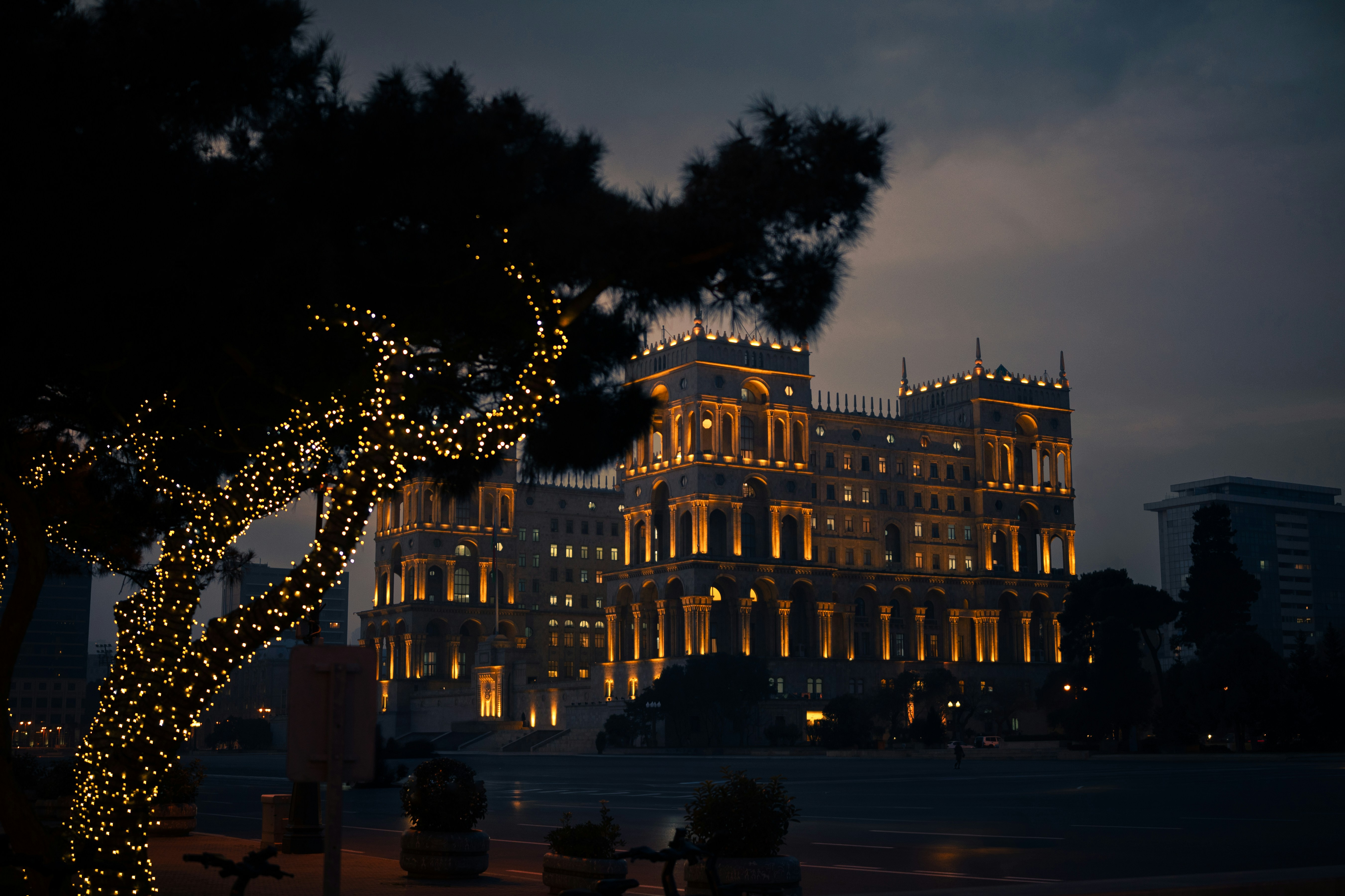 Illuminated Palace at Dusk: A Veil of Warm Lights