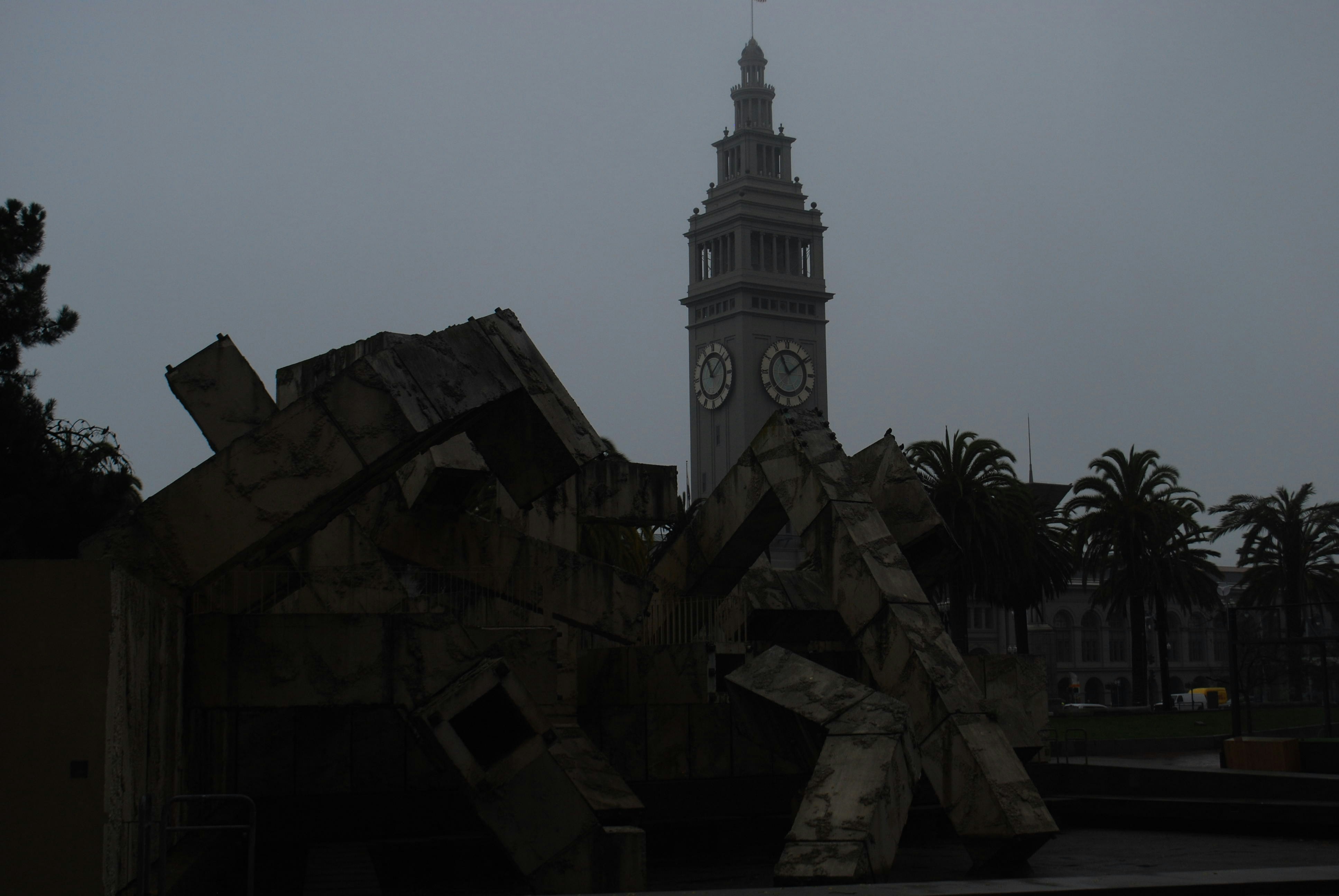 An abstract fountain sits in-front of the San Fransisco Ferry Building