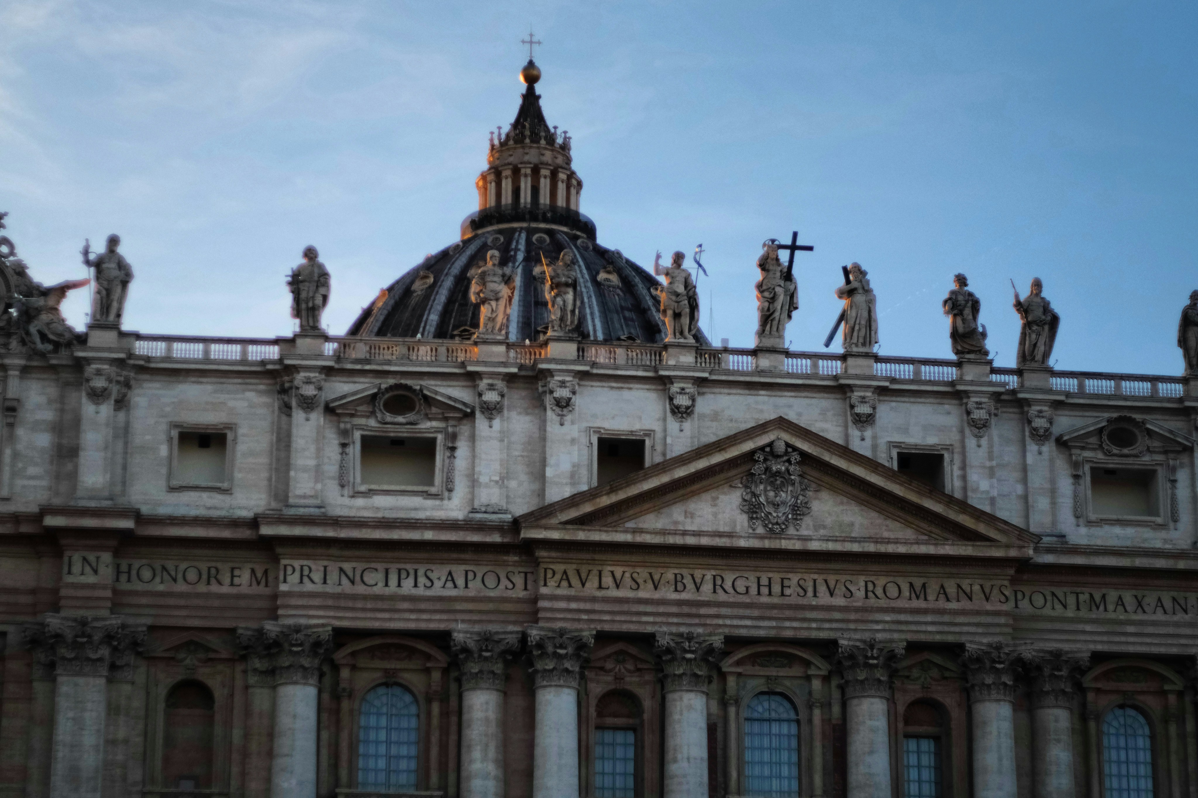 A large building with statues on top of it photo – Free City Image on ...