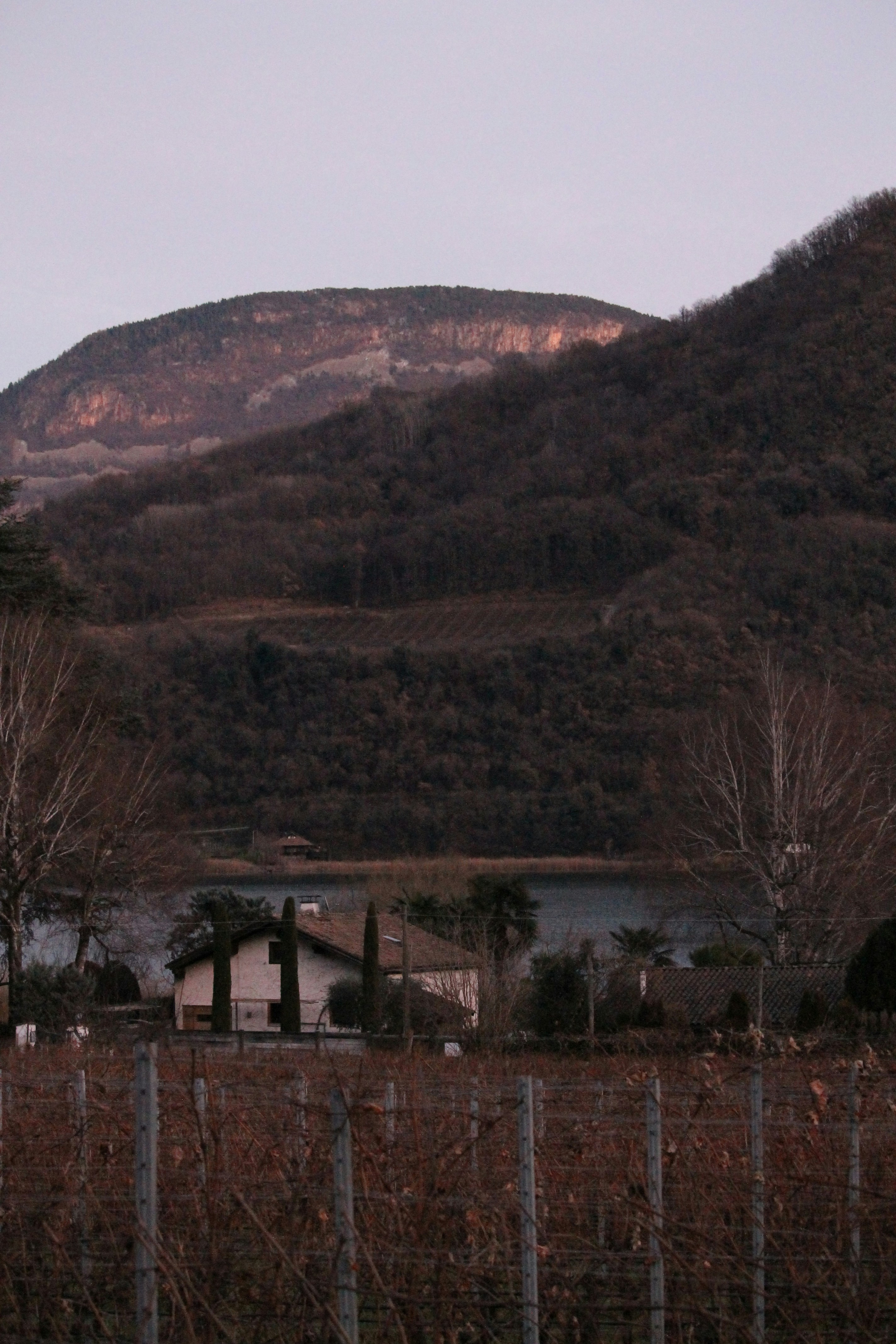 Sunlit Crest Over a Quiet Lakeside Valley