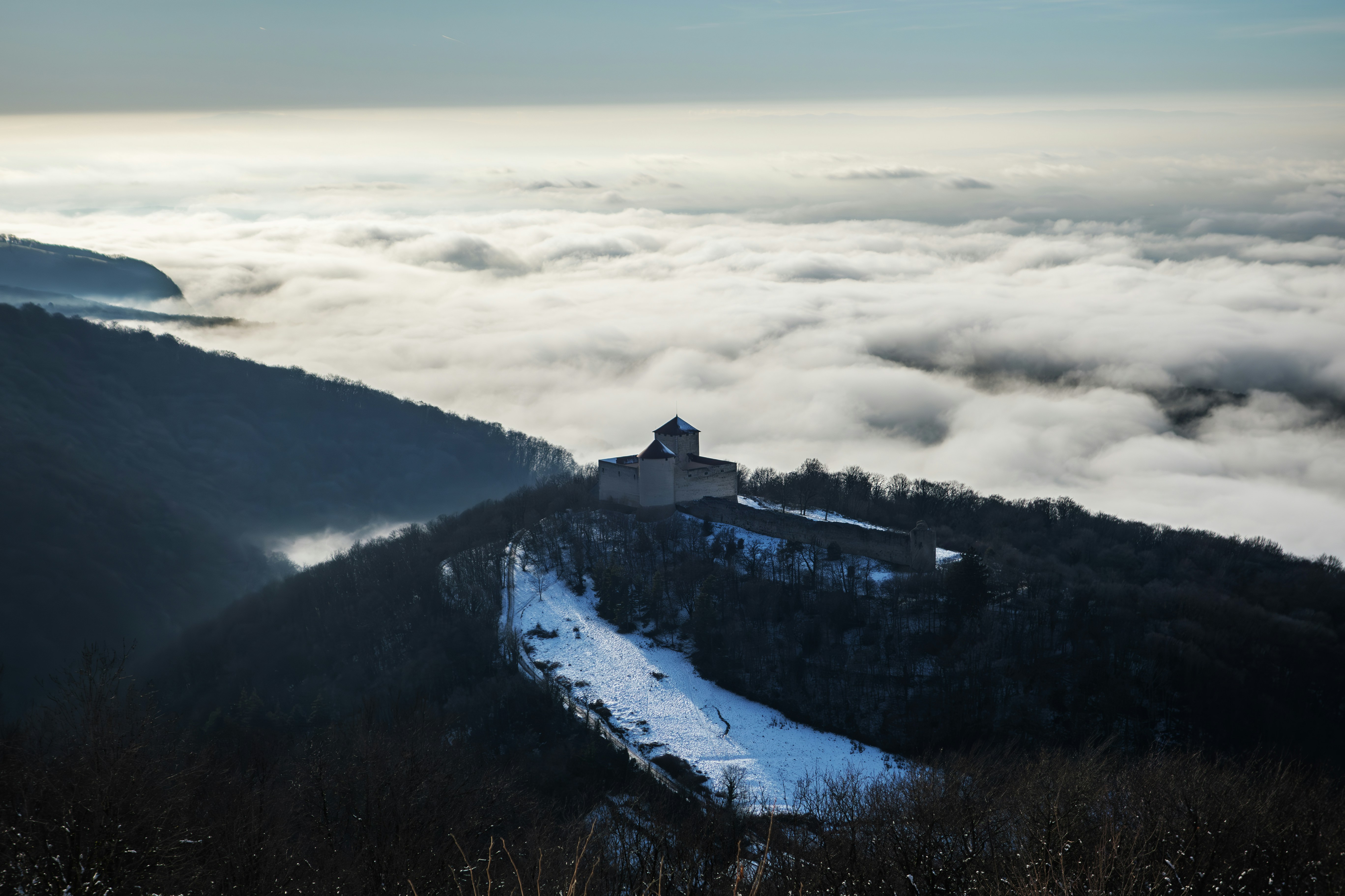 Snow-covered Mont Luisandre and Allymes Castle rise above a sea of clouds on Christmas Day.