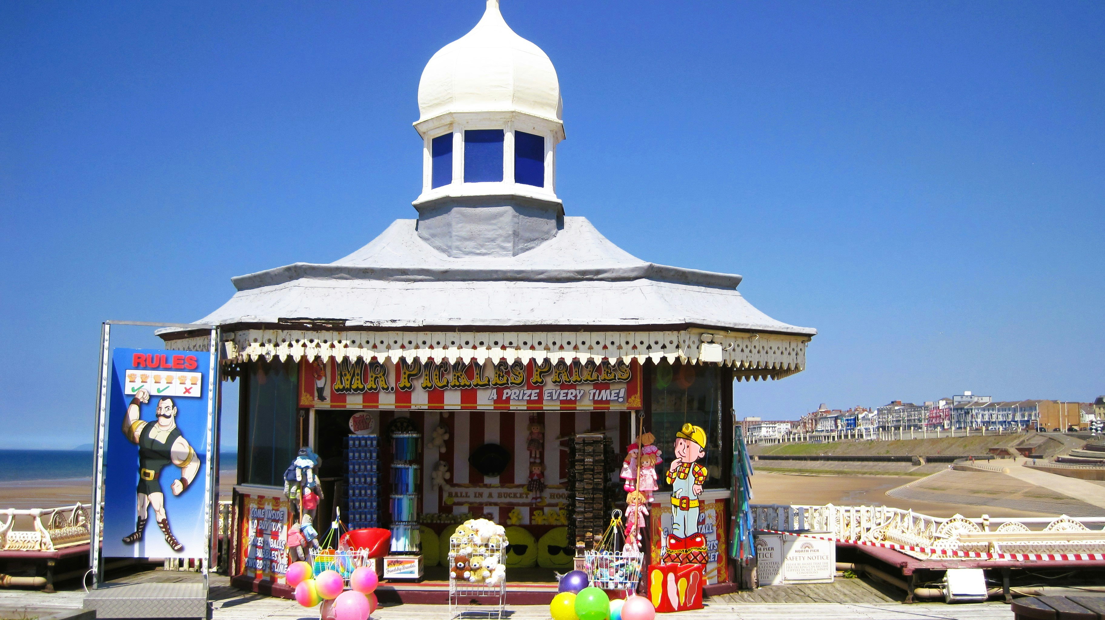 Domefront by the Sea: A Tiny Toy Arcade Beneath a White Pavilion