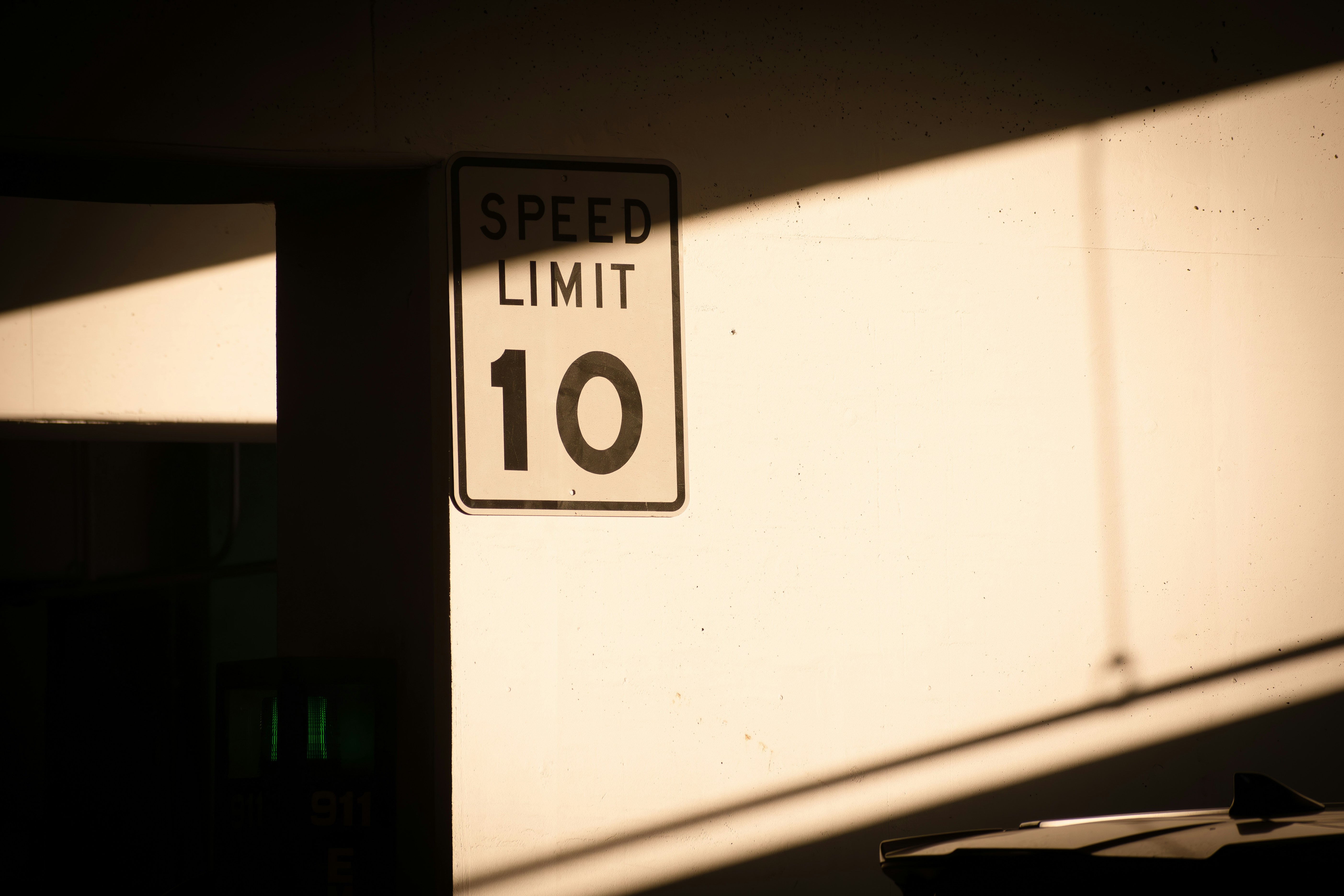 A speed limit sign in a dark room photo – Free Ca Image on Unsplash
