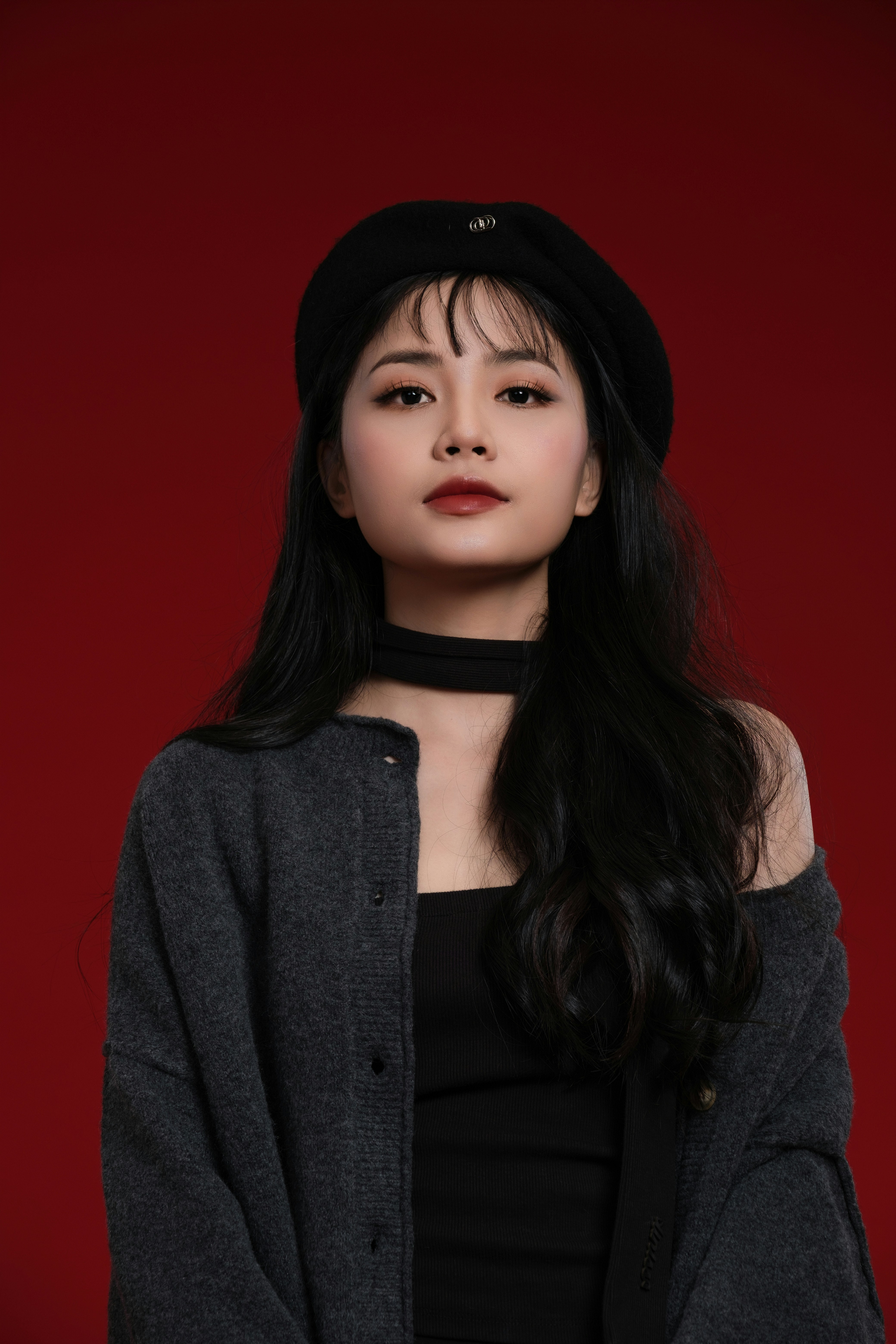 A woman with long black hair wearing a black hat photo – Free Portrait ...