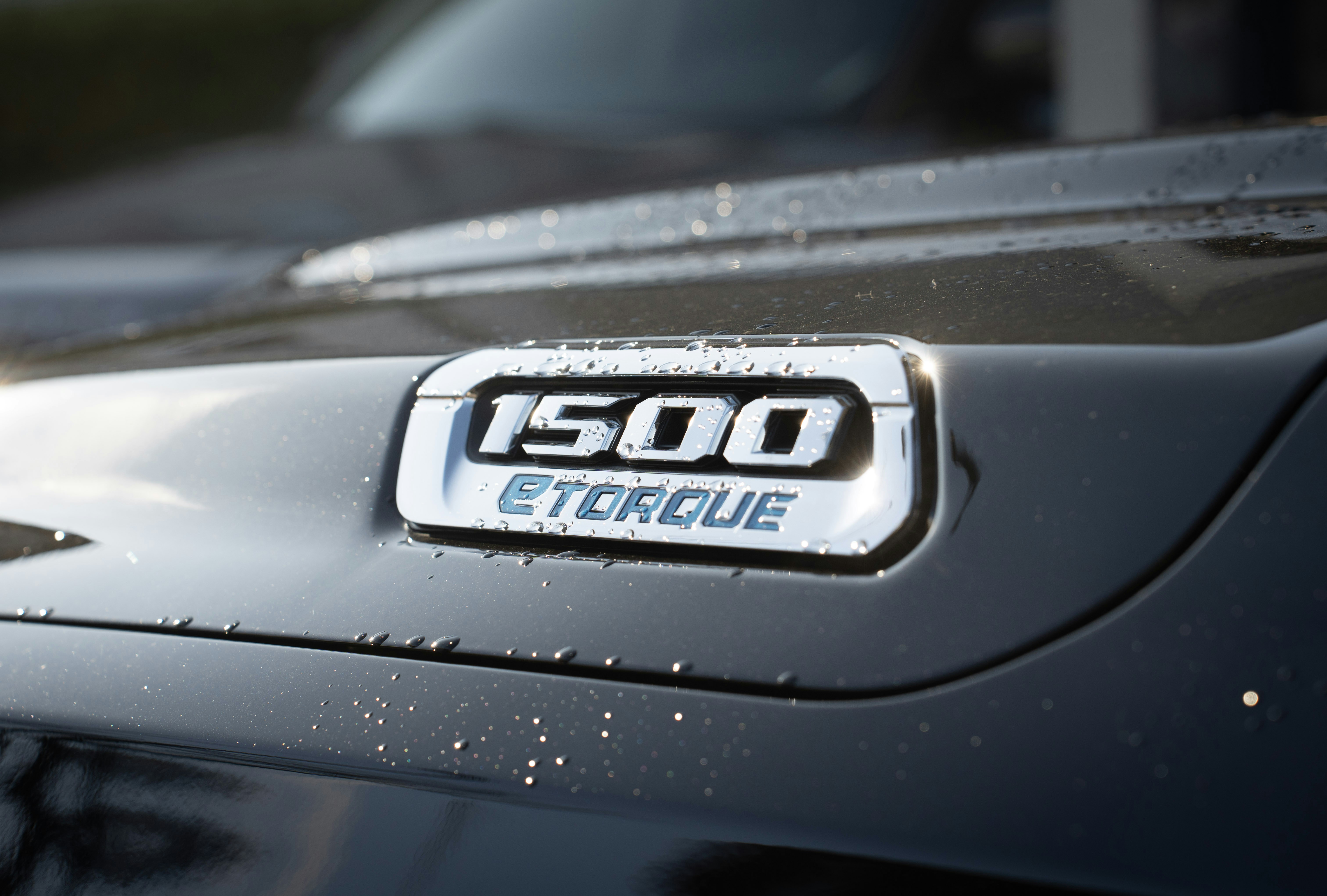 Emblem in Focus: Ram 1500 eTorque on a Rain-Speckled Hood