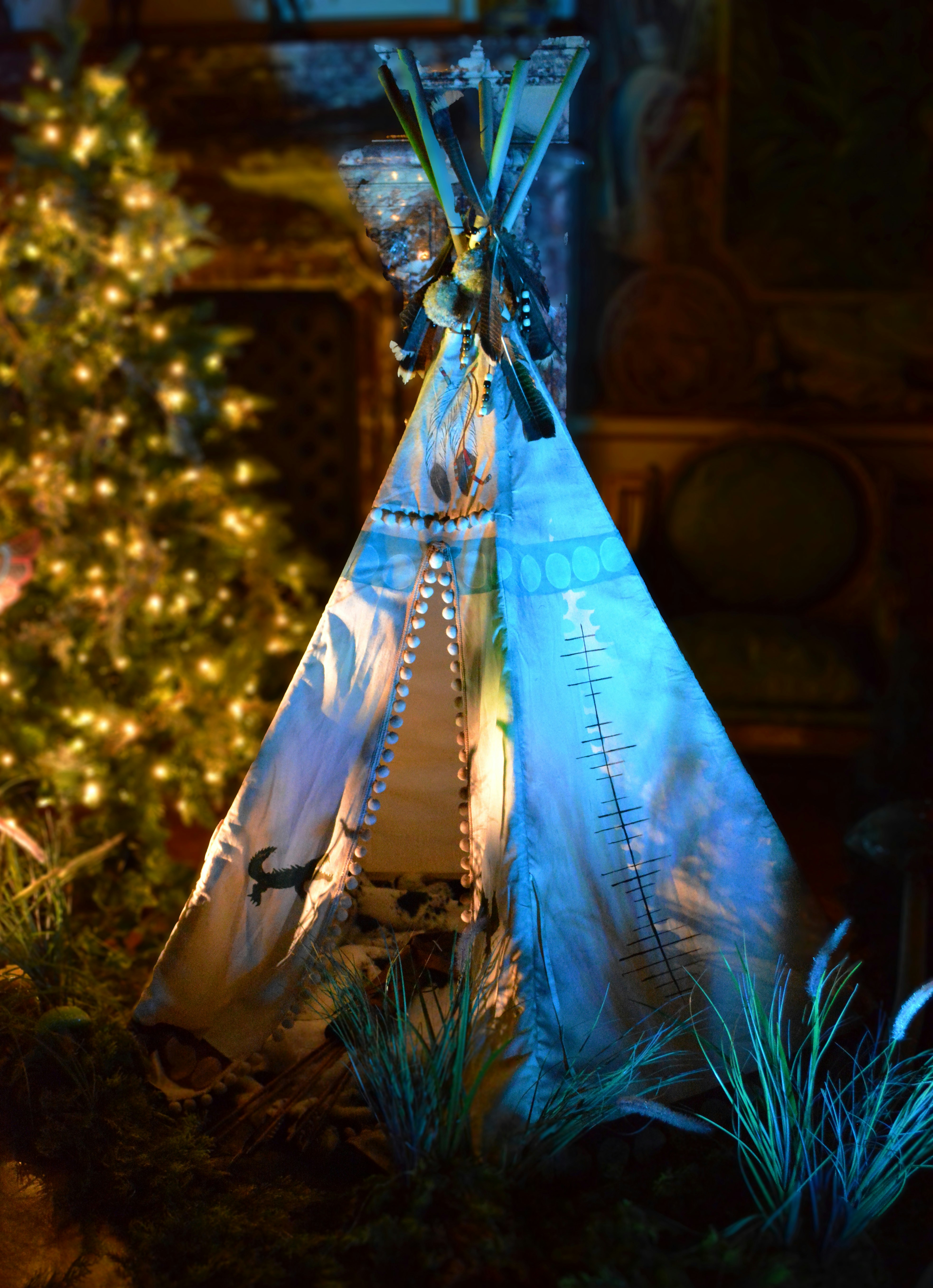 A teepee sitting next to a christmas tree photo – Free Christmas Image ...