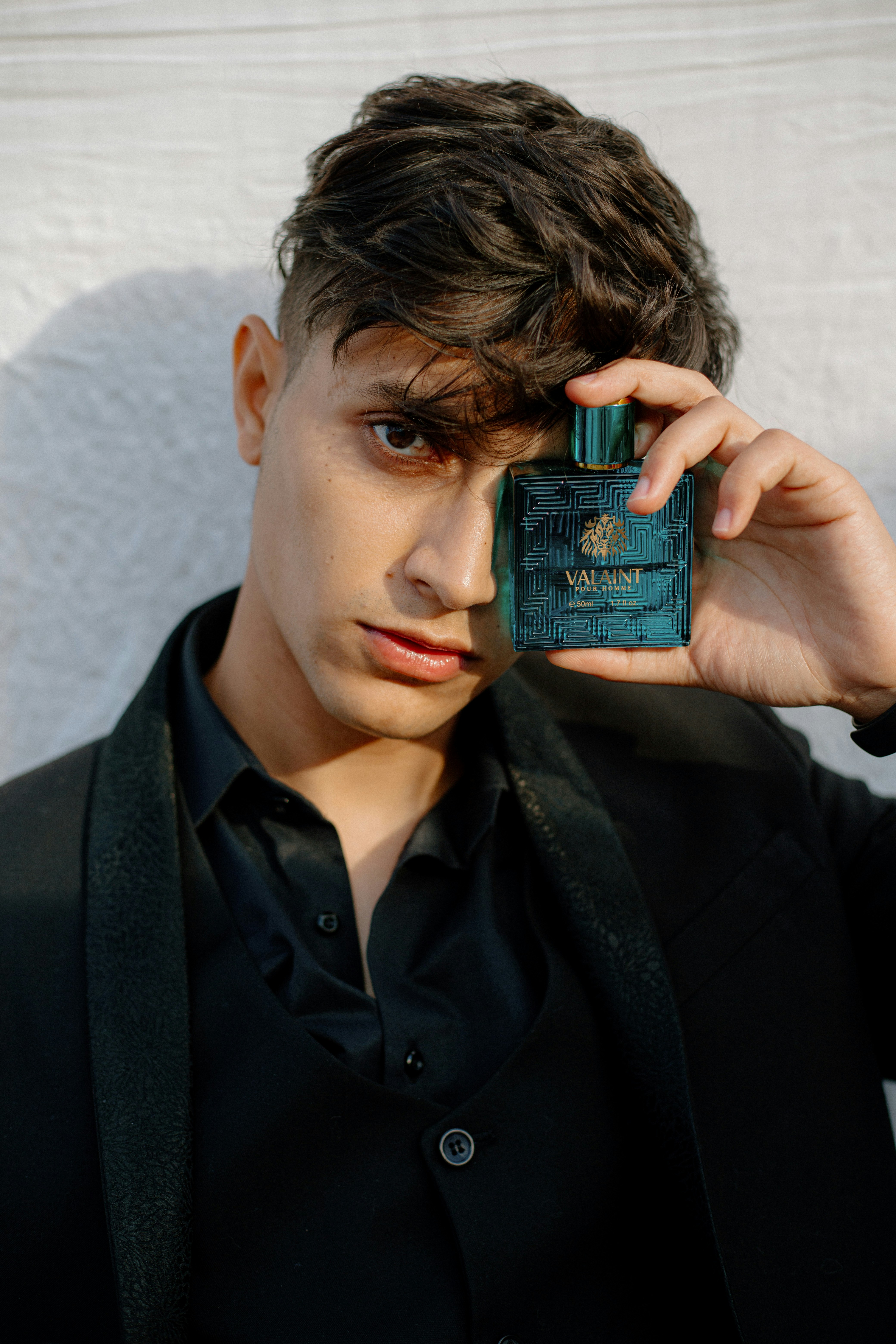 Teal Perfume, Quiet Focus: A Close Portrait with a Bottle