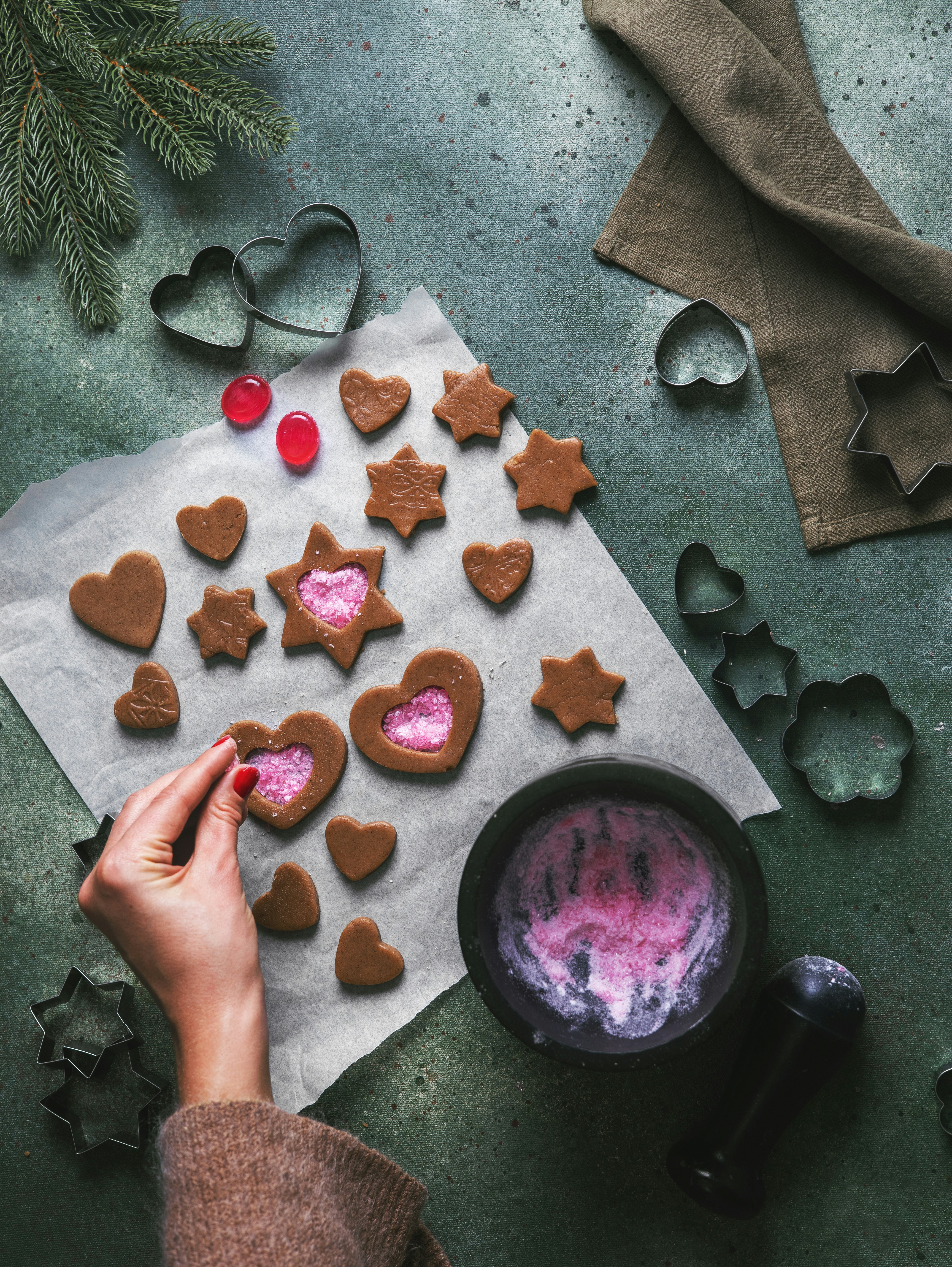 A person decorating cookies on a table photo – Free Food and drink ...