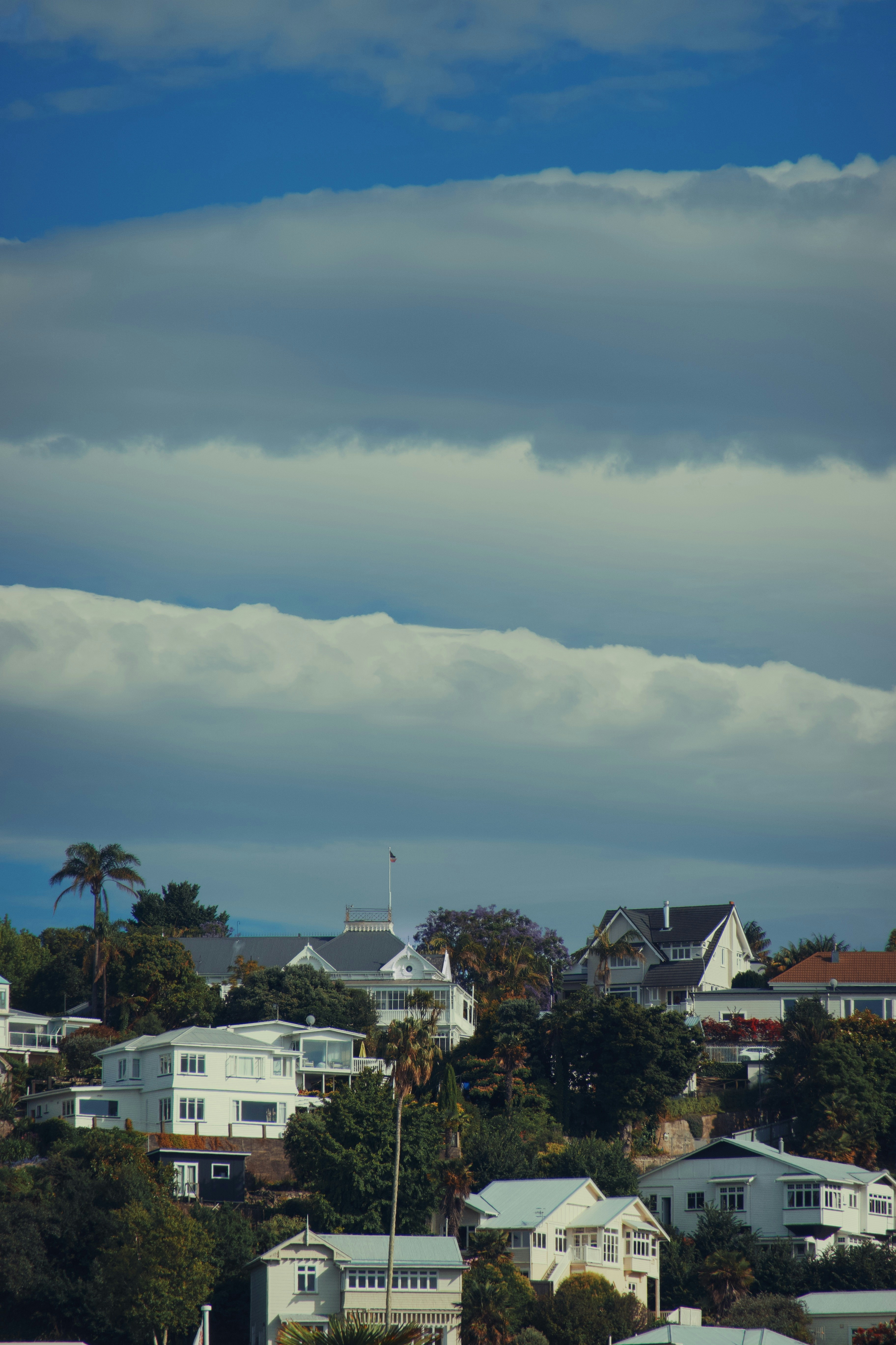 Coastal Suburb Under Layered Sky