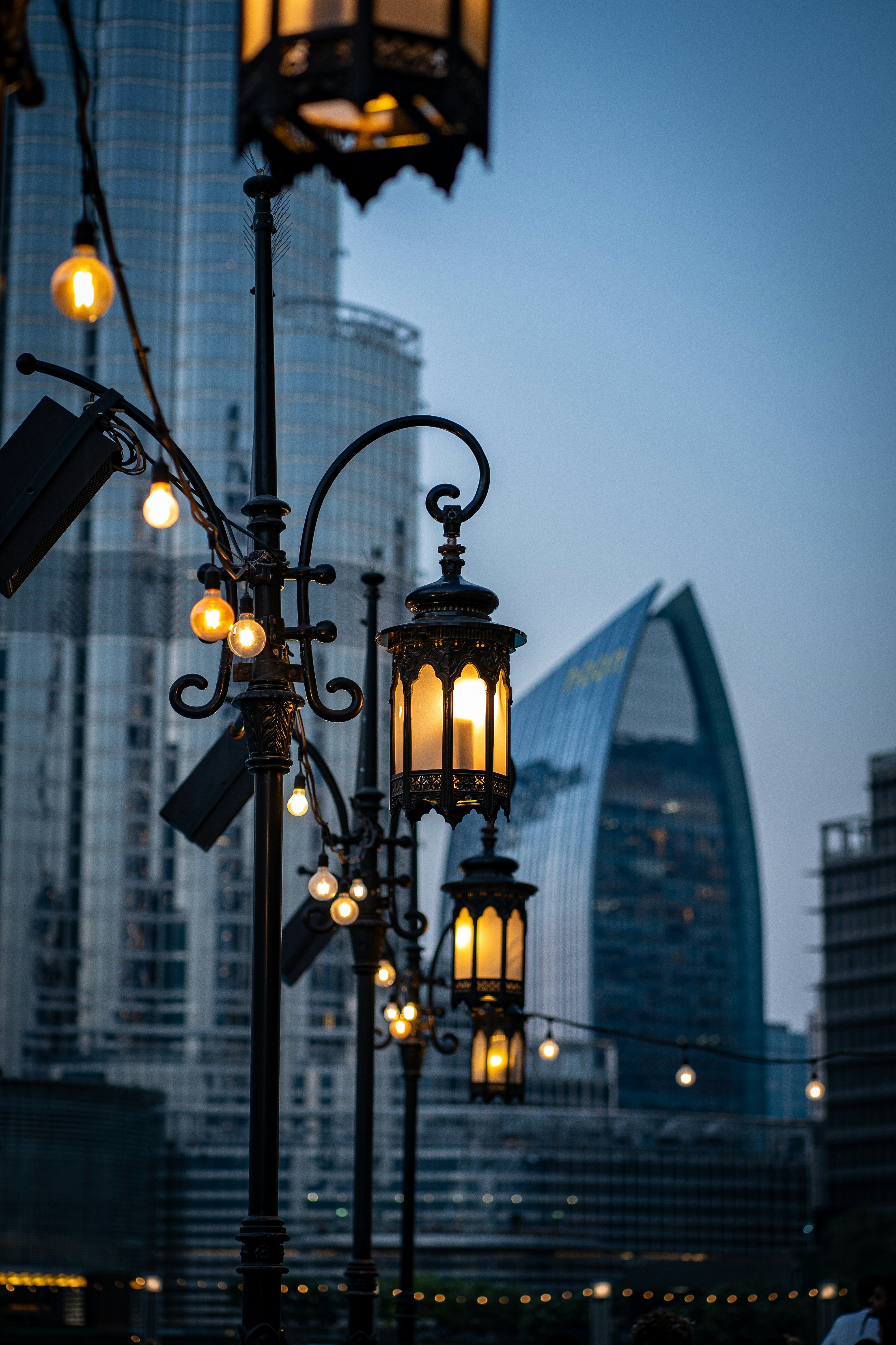 Lantern Row Framing a Modern Skyline at Dusk