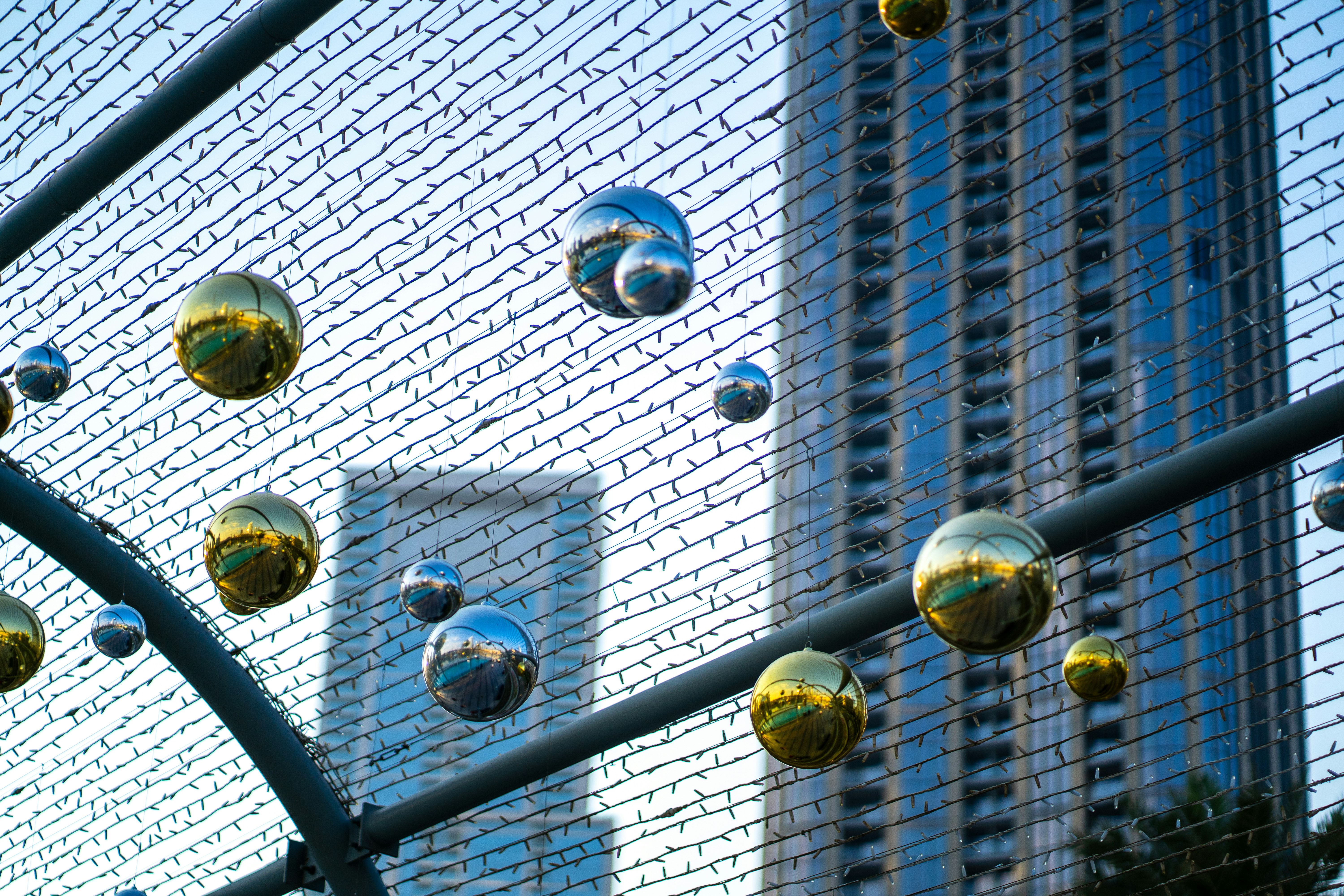 Floating Orbs Above a City Mesh