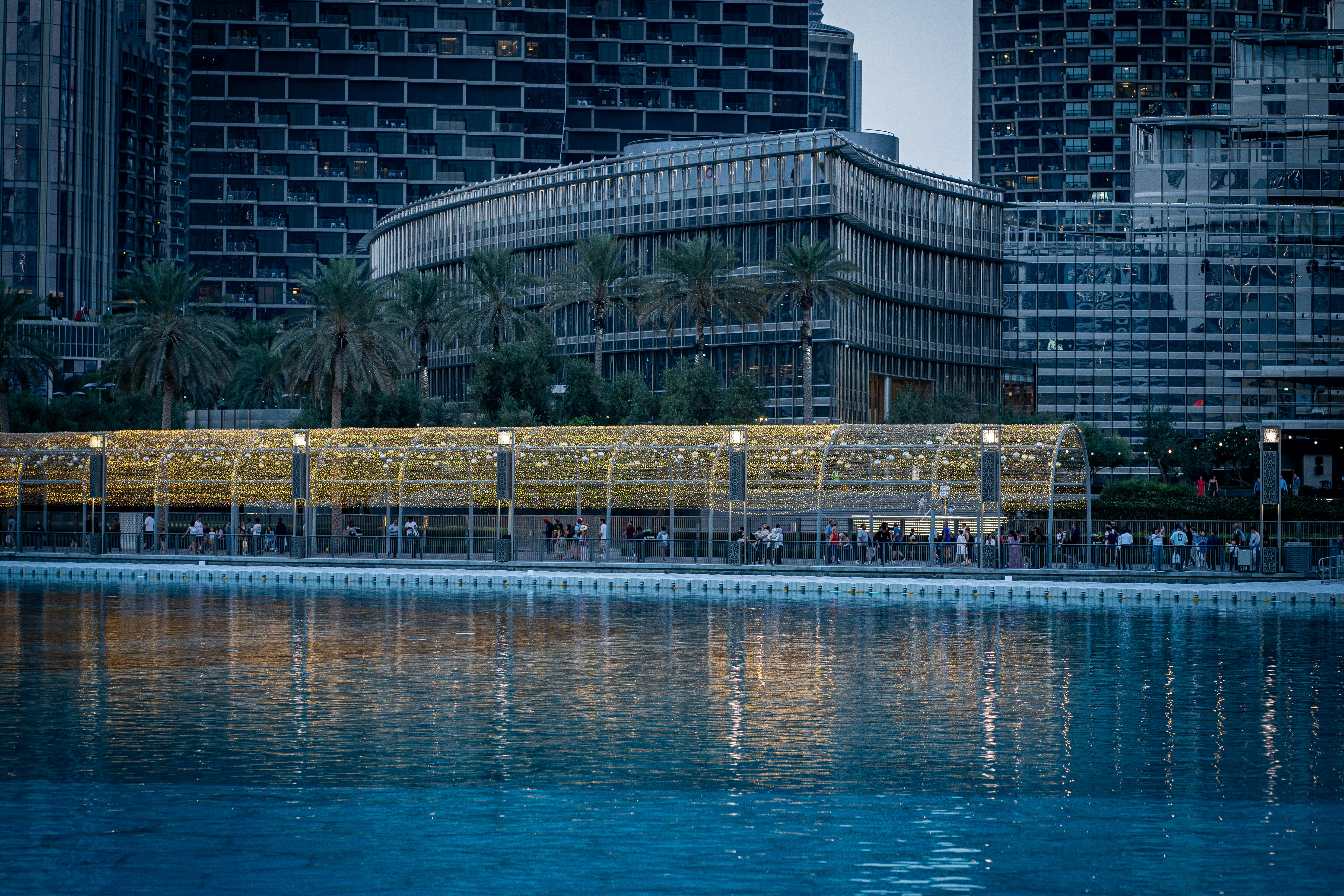 A large body of water surrounded by tall buildings photo – Free Burj ...