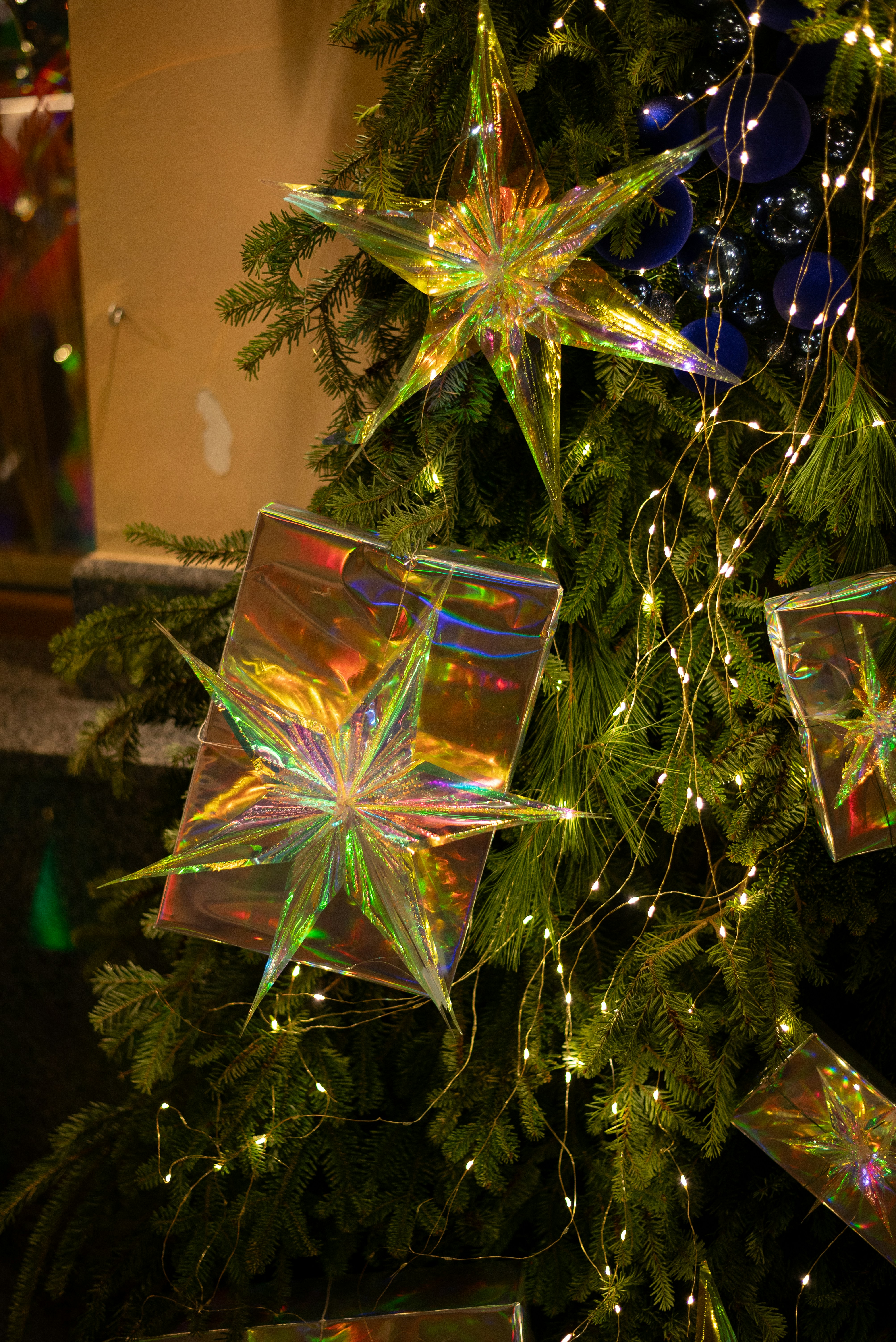 Iridescent Starbursts Draped Across a Cozy Christmas Tree