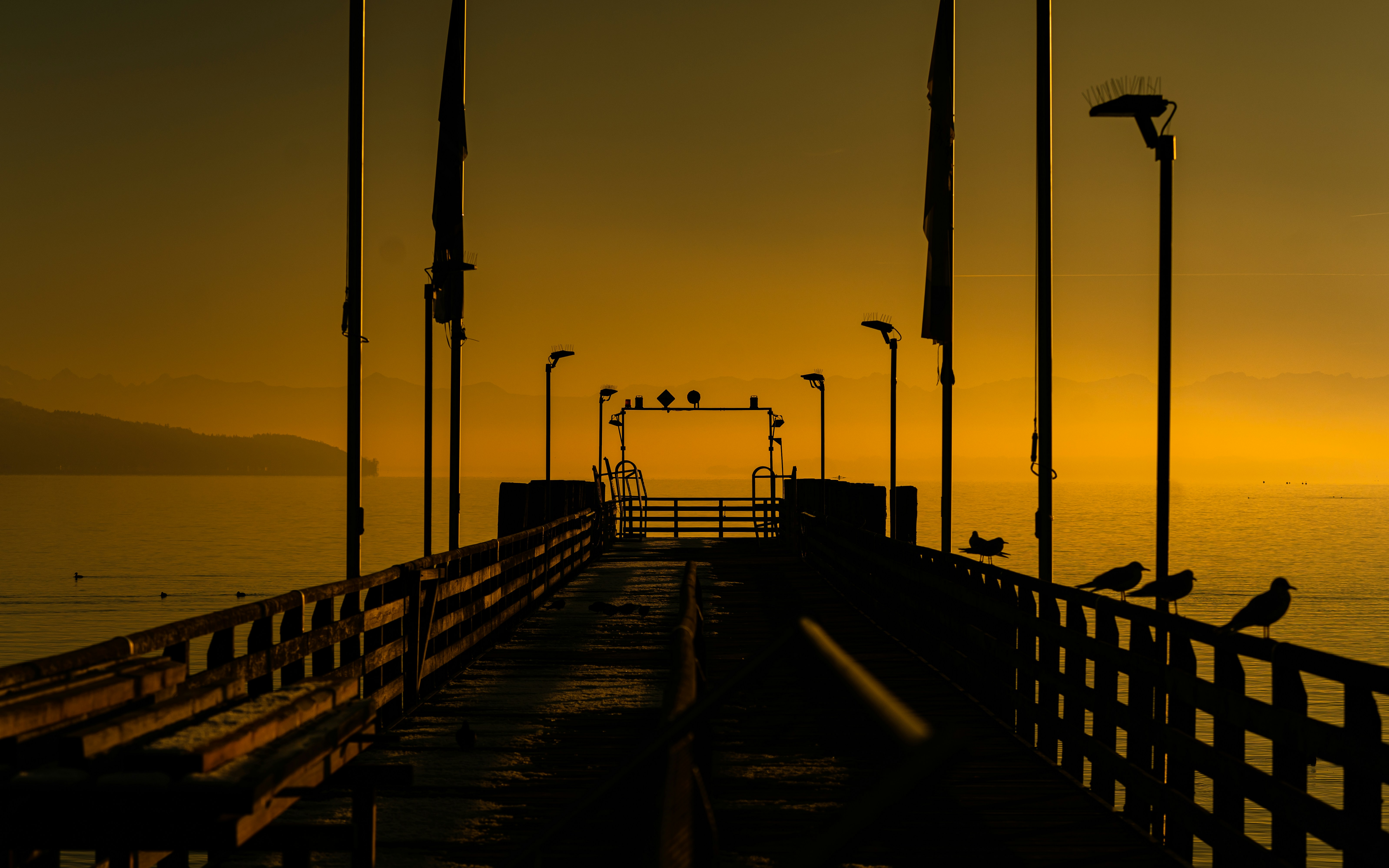 Horizon Gate at Dusk: A Silent Pier Reaches for the Golden Sea