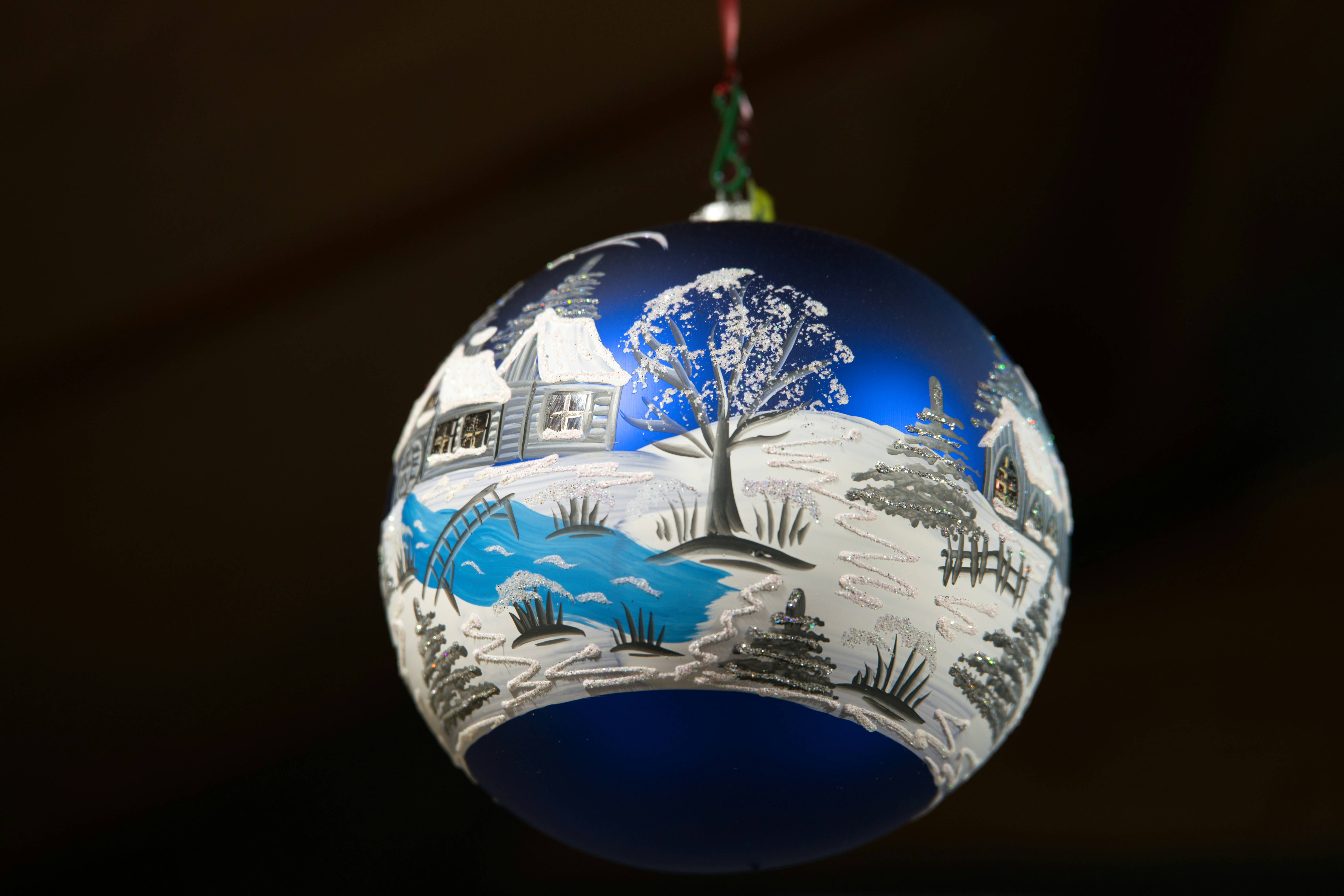 Hanging Winter Panorama: A Hand-Painted Snow Scene on a Sapphire Ornament