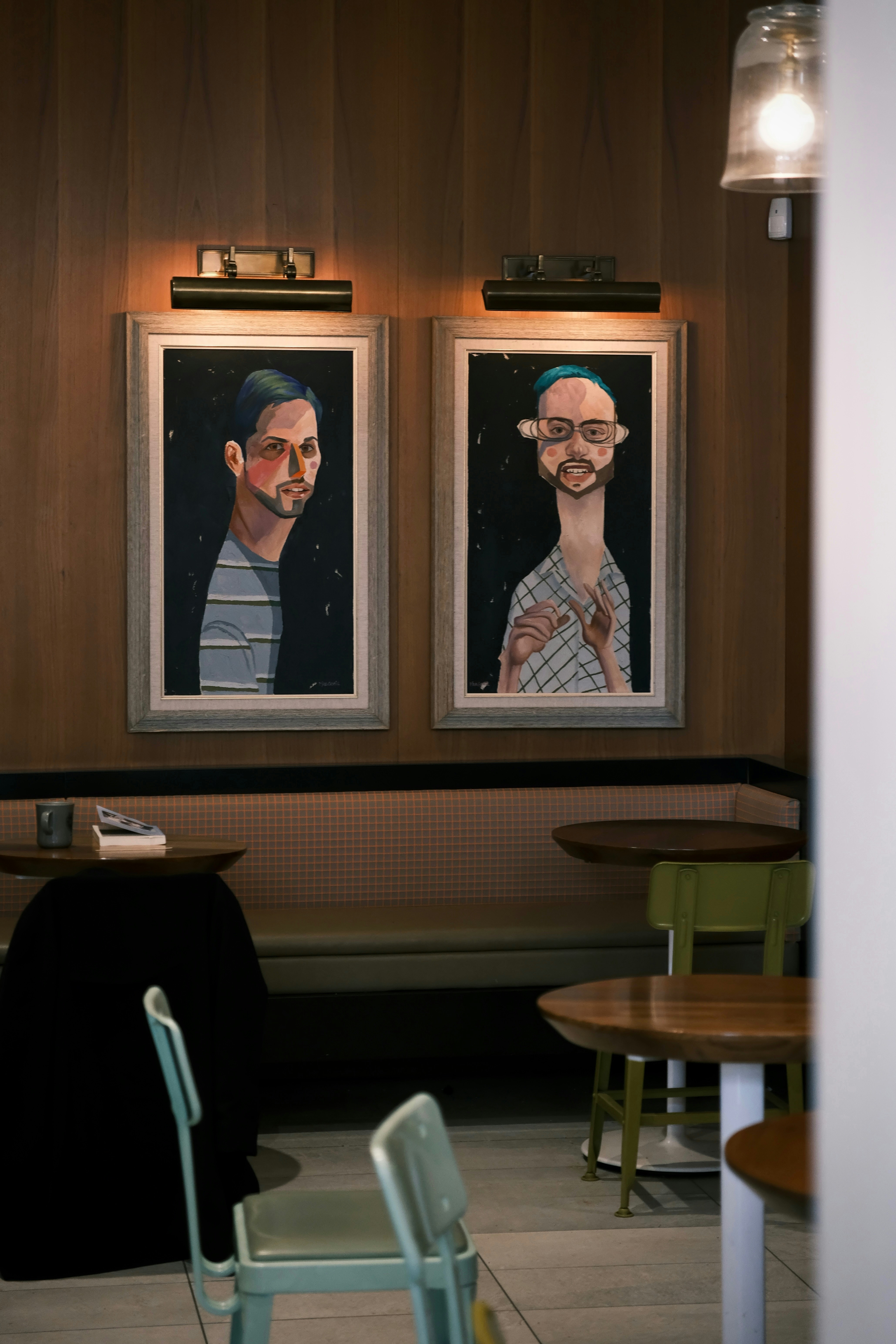 A couple of paintings of people in a restaurant photo – Free Indoors ...
